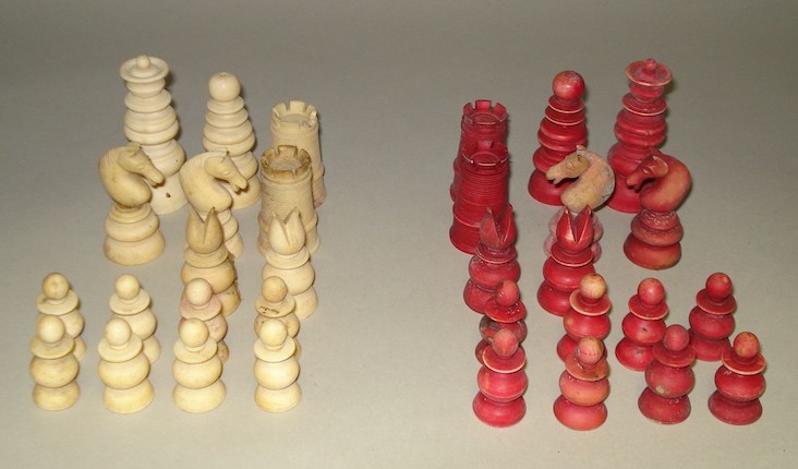 Bonhams A Matched 19th Century Indian Ivory Chess Set And A Leather Folding Games Board