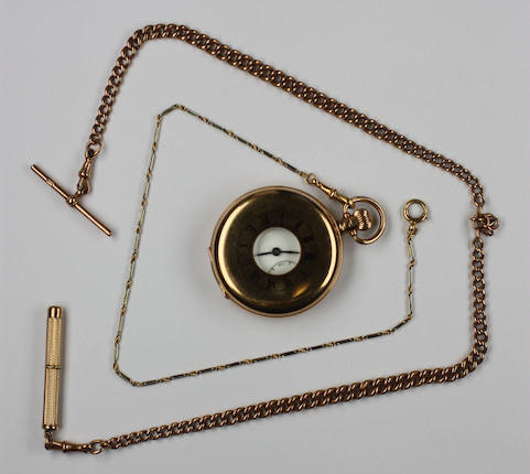 Bonhams : A 9ct gold half hunter pocket watch, and Albert chains