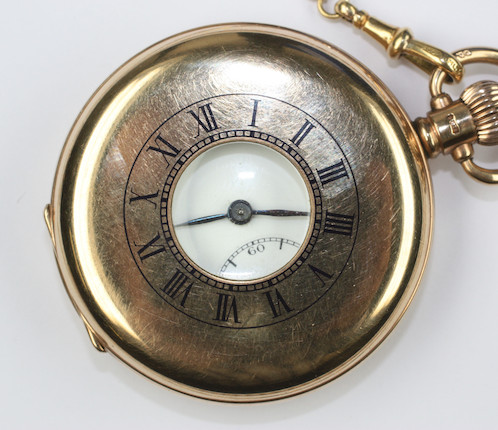 Bonhams : A 9ct gold half hunter pocket watch, and Albert chains