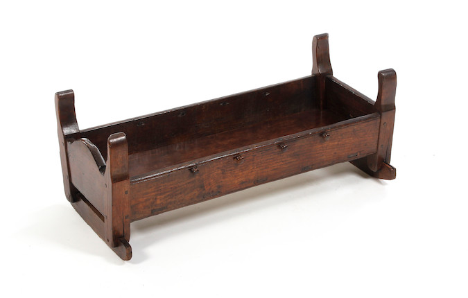 Bonhams : A late 17th Century oak cradleOf unusual shallow form