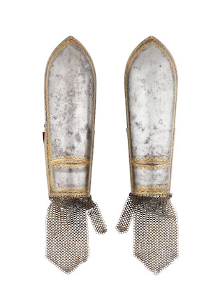 Bonhams : A Pair of Indian Gold-Damascened Dastana (Arm-Guards)