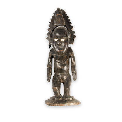 Bonhams : A Solomon Islands carved and stained hardwood ancestral figure