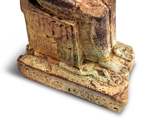 Bonhams : An Egyptian inlaid bichrome faience enthroned Bastet with ...