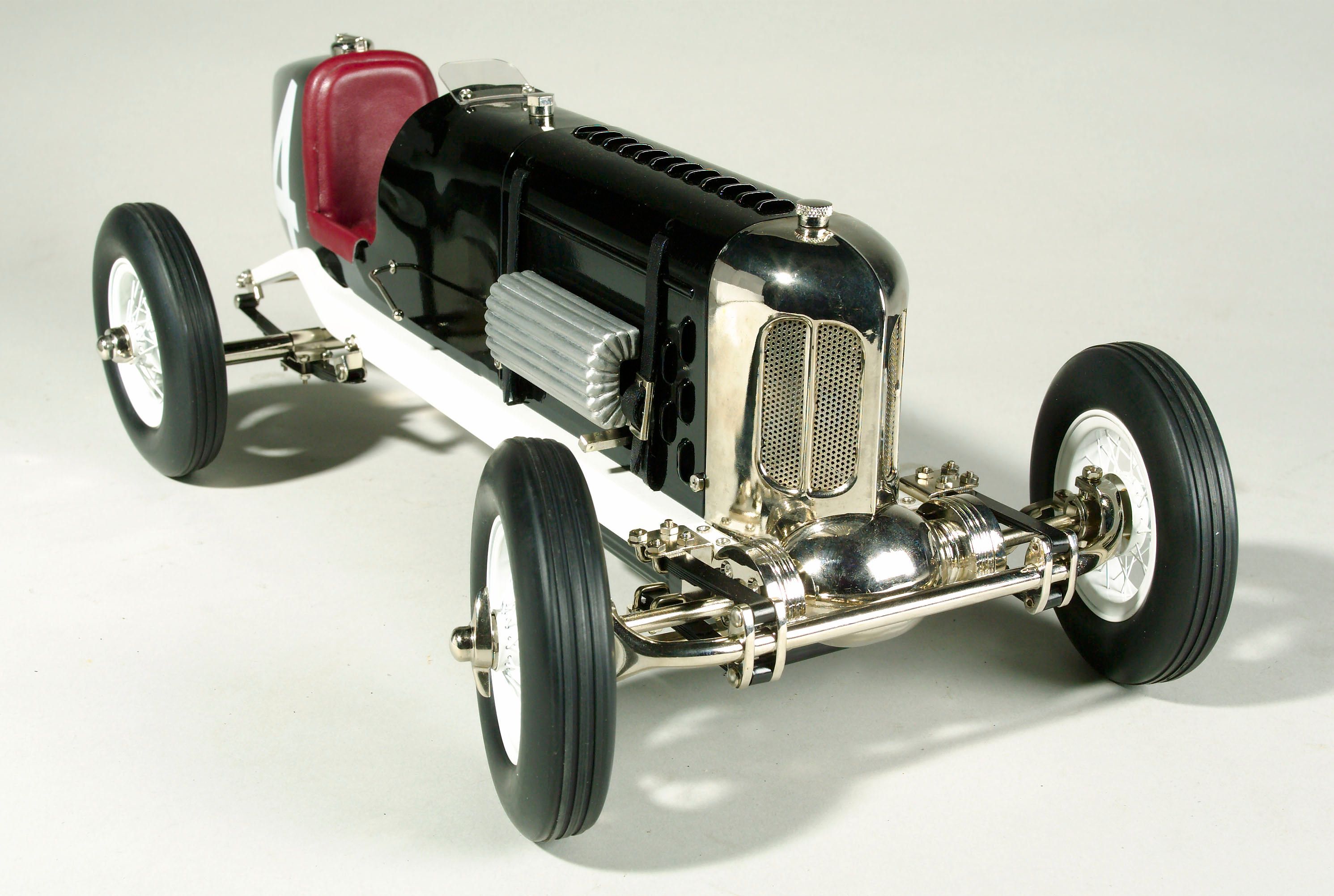 Bonhams Cars : A 18 scale 'Miller' tinplate clockwork driven model,