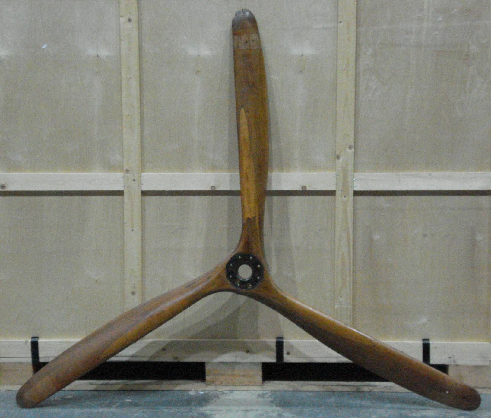 Bonhams Cars : A three bladed wooden aircraft propeller,
