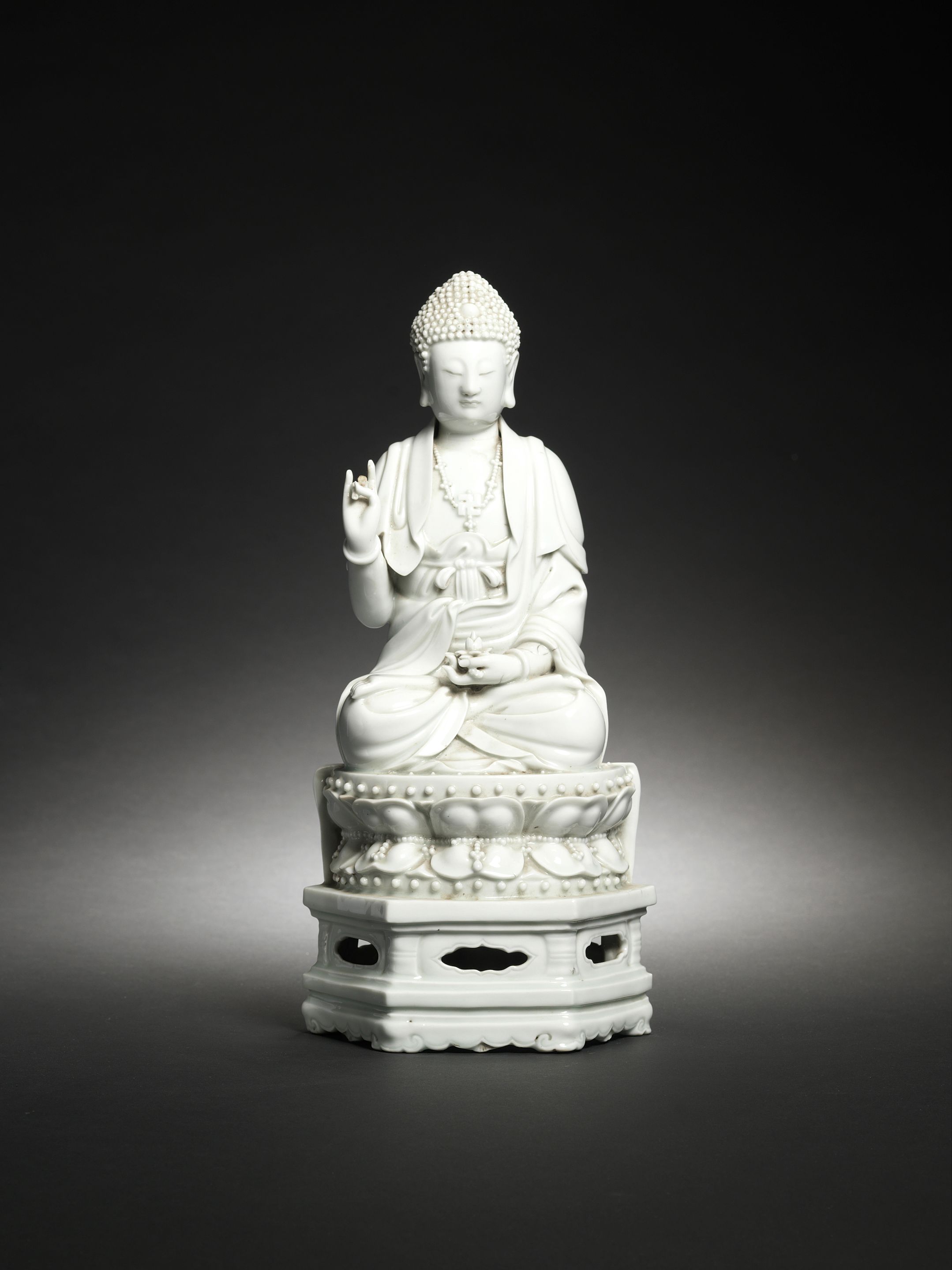 Bonhams : A blanc-de-chine figure of Buddha Impressed pu ji yu ren mark ...