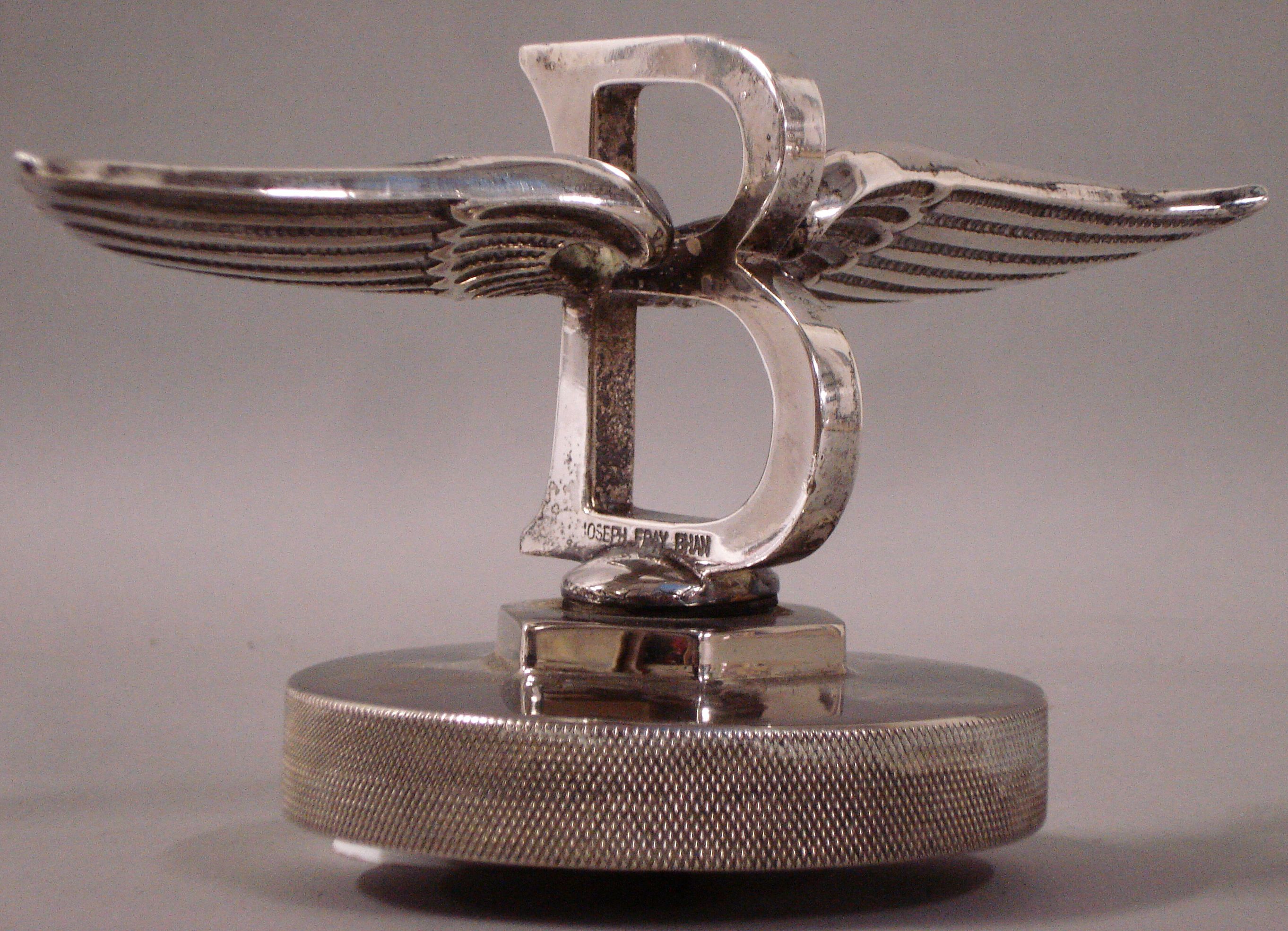 Bonhams Cars : A Bentley radiator cap,