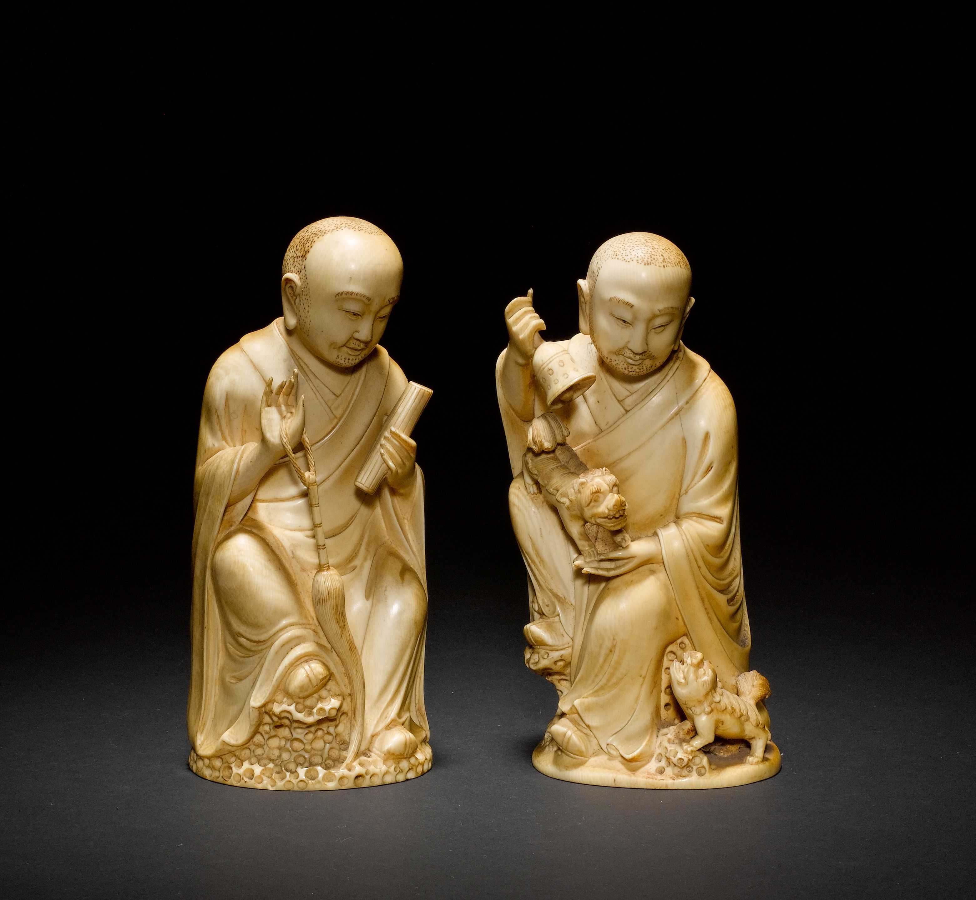 Bonhams : Two stained ivory figures of Luohan 19th century
