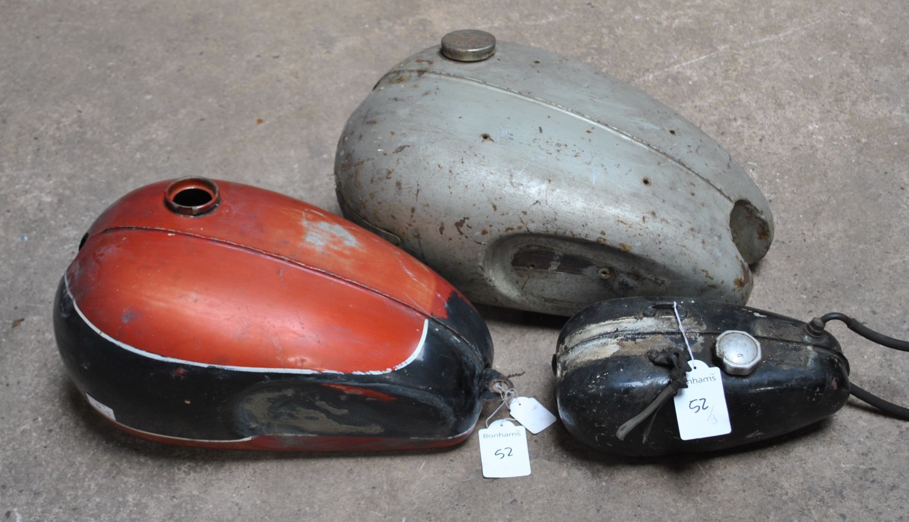 Bonhams Cars : Two Triumph fuel tanks,