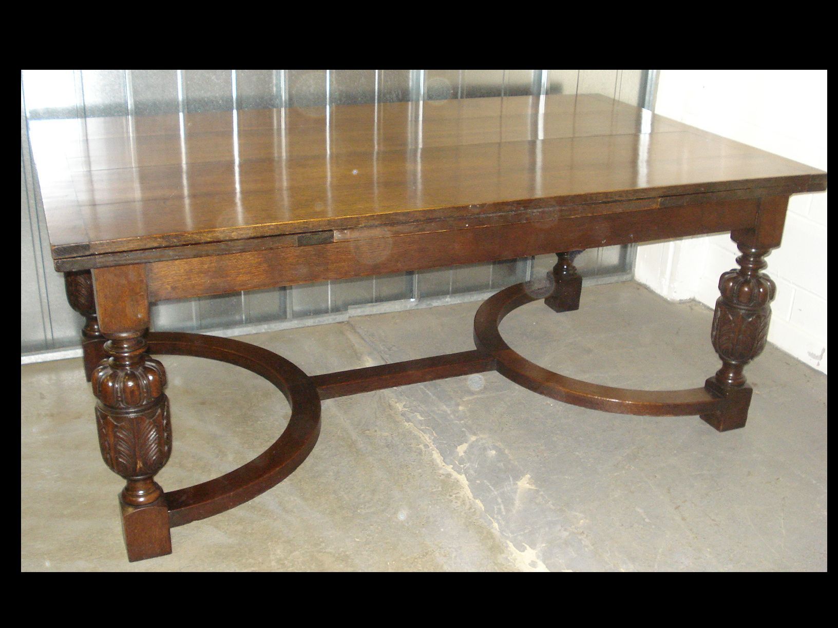Bonhams : An Elizabethan style oak draw leaf dining table,
