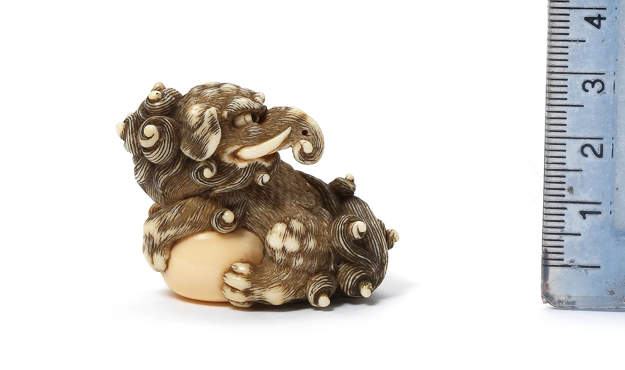 Bonhams : An ivory netsuke of a baku Kansai, early 19th century