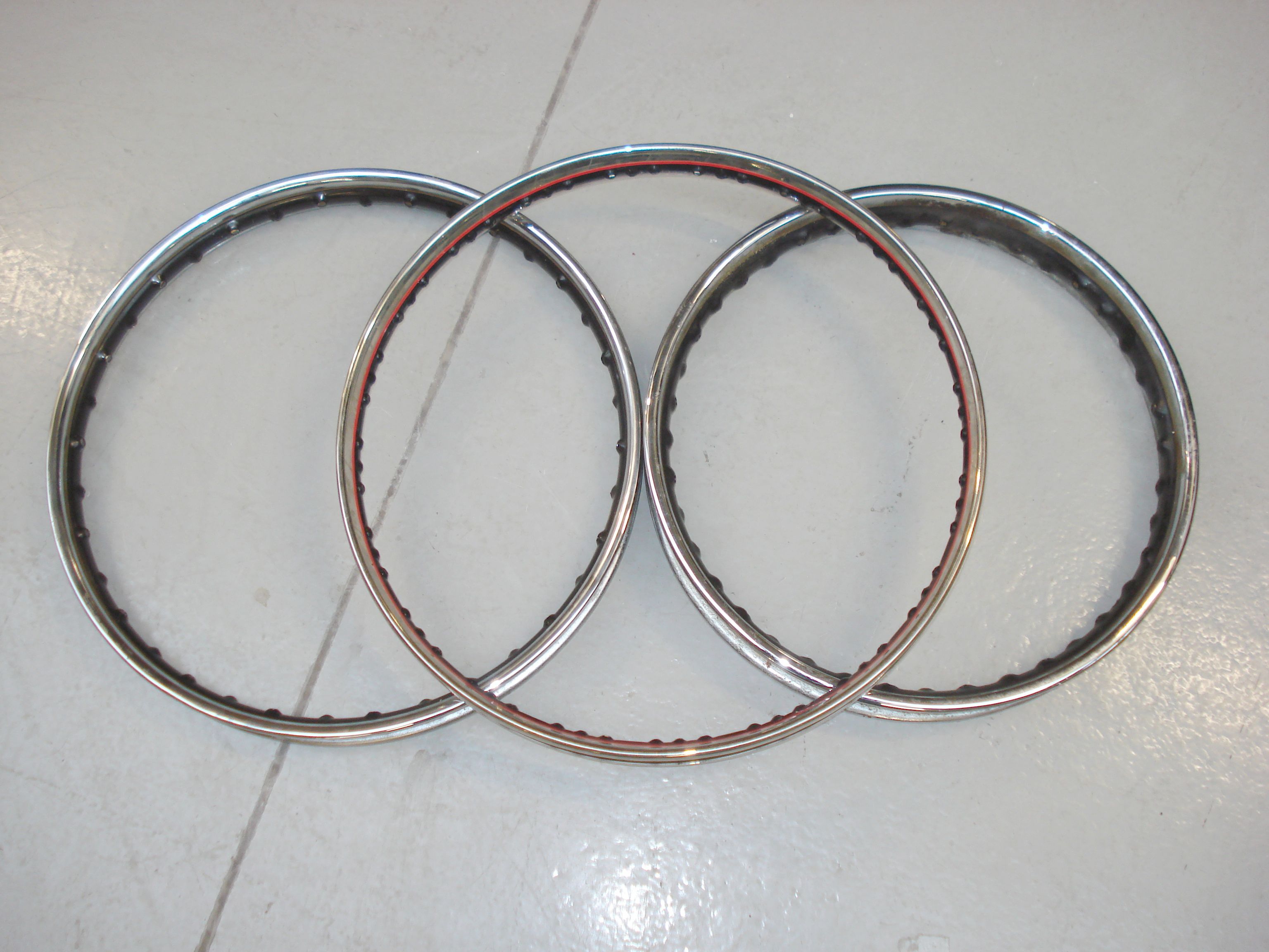 Bonhams Cars : Three wheel rims with painted strips,