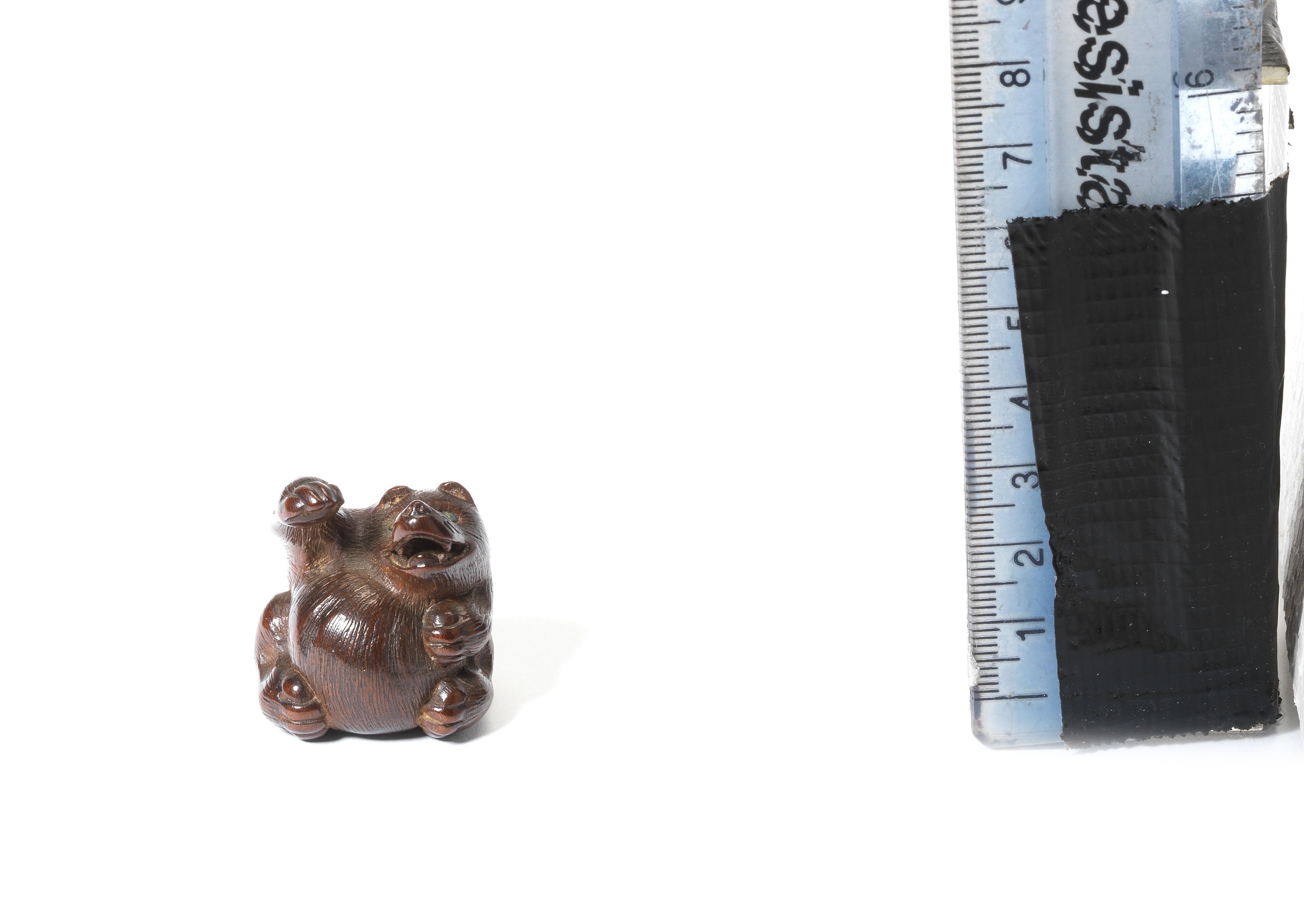 Bonhams : A wood netsuke of a tanuki (raccoon dog) By Kokei, early 19th ...