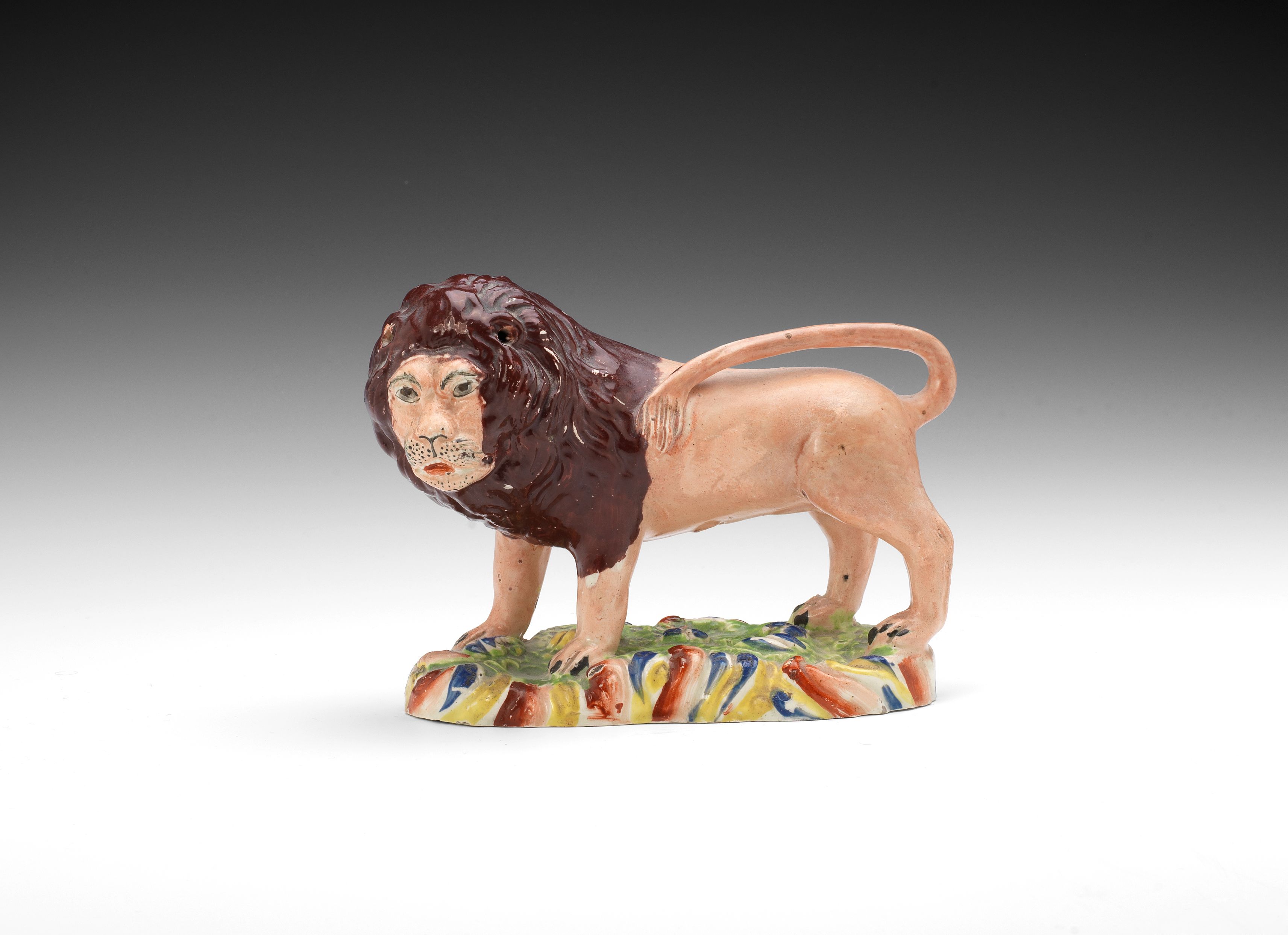 Bonhams : A Staffordshire model of a lion, circa 1820-25