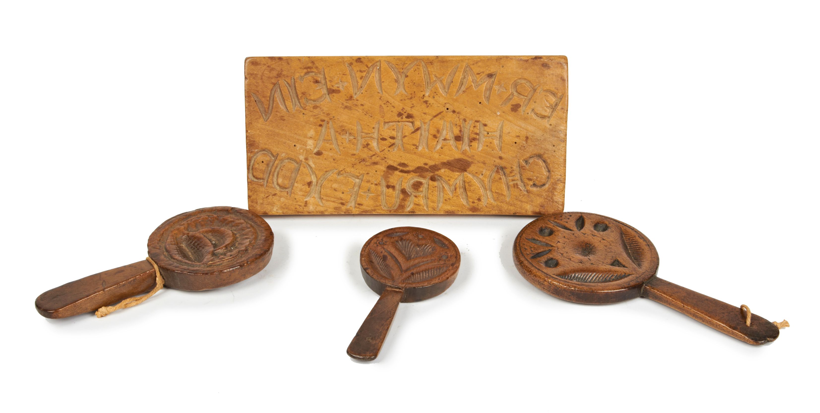 Bonhams : Three 19th century sycamore butter slappers with markers