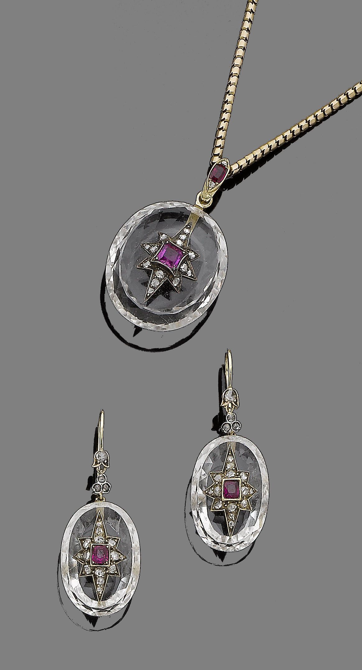 Bonhams : A late 19th century rock crystal, ruby and diamond pendant necklace and earring suite (2)