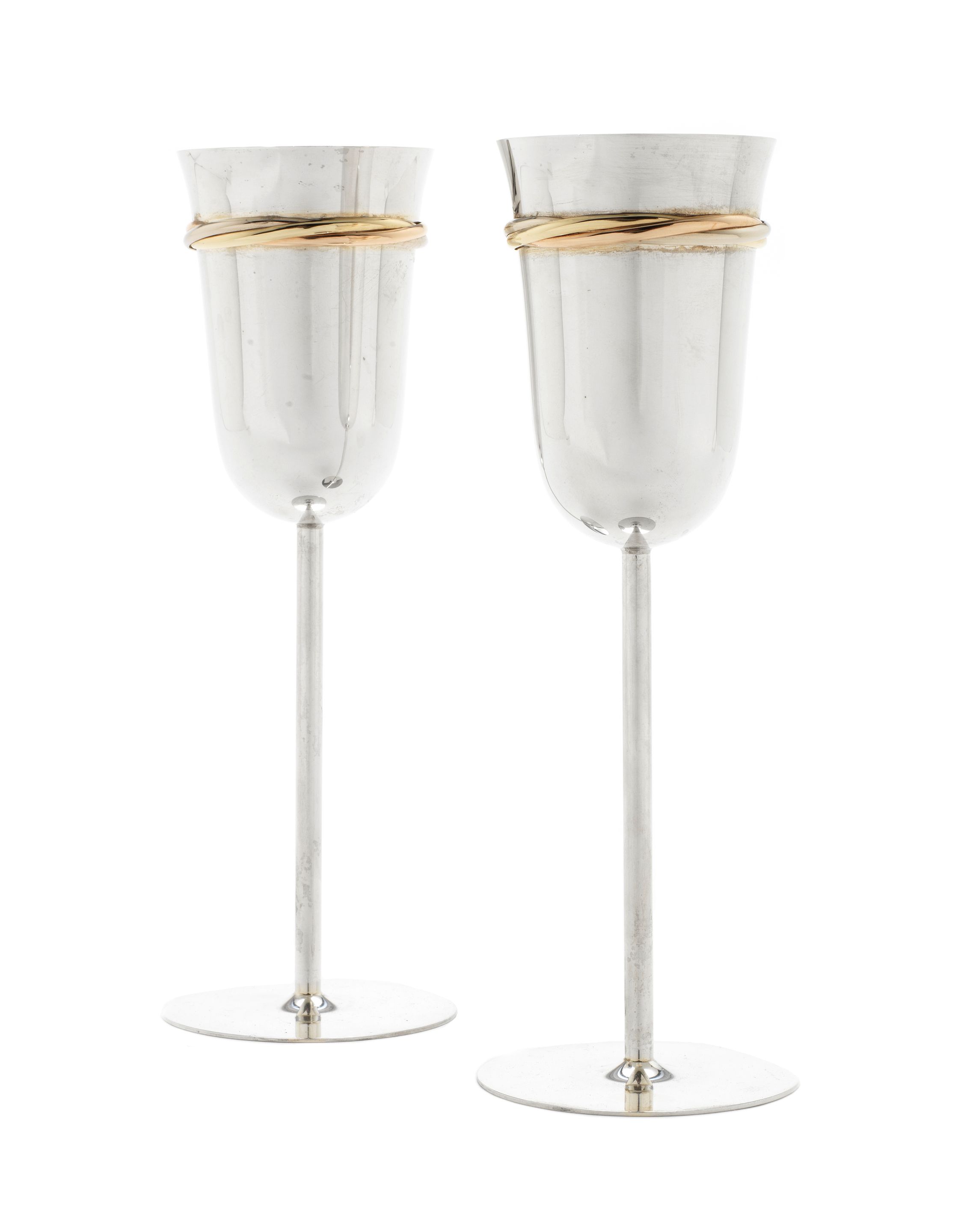 Bonhams : CARTIER Two silver champagne flutes bases with incuse mark ...