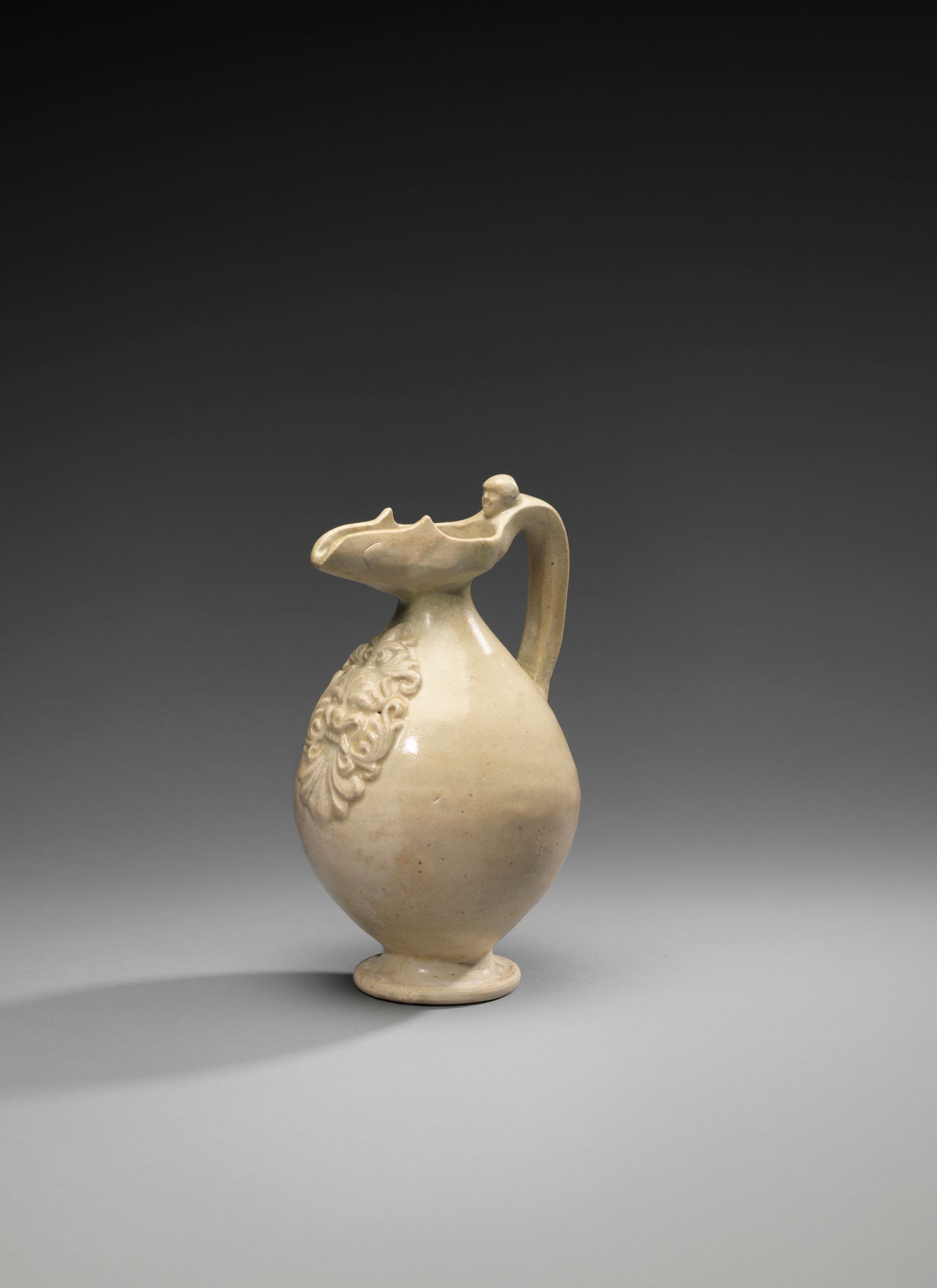 Bonhams : A very rare straw-glazed 'monster-mask' ewer Sui/Tang Dynasty