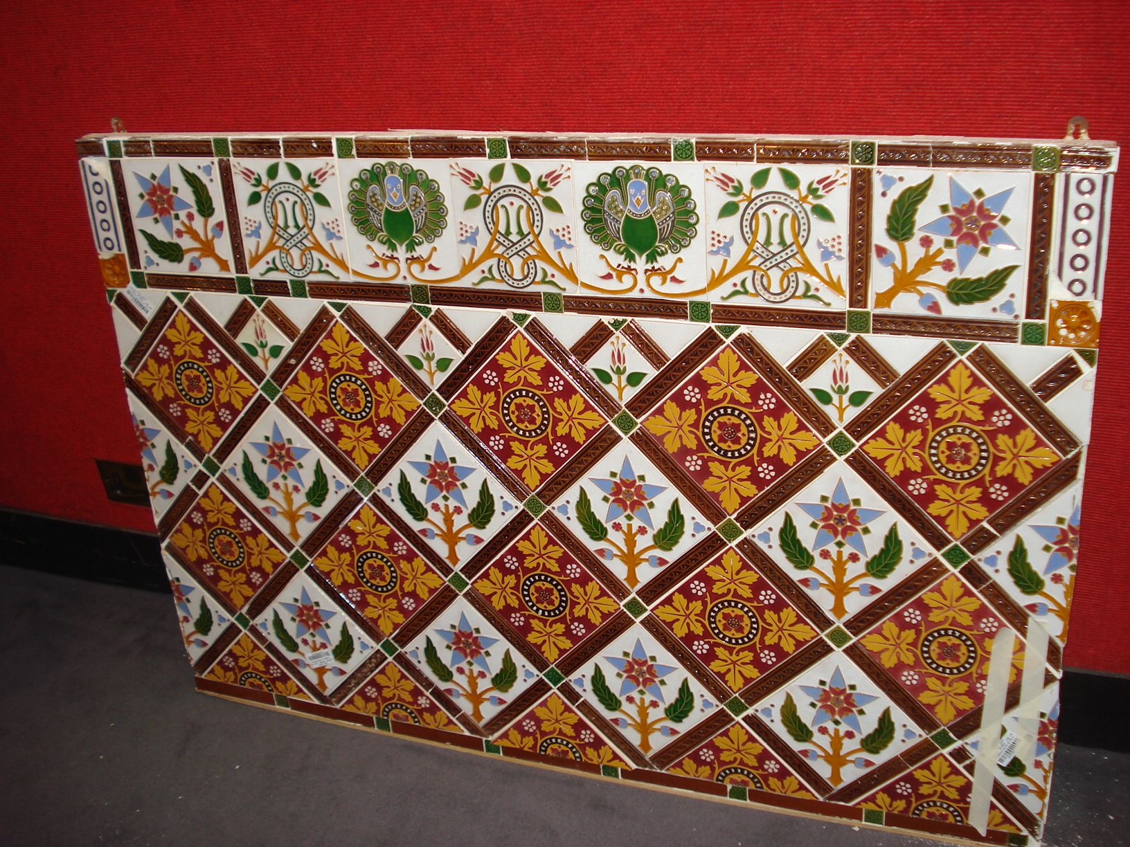 Bonhams : A large decorative wooden-backed tile panel