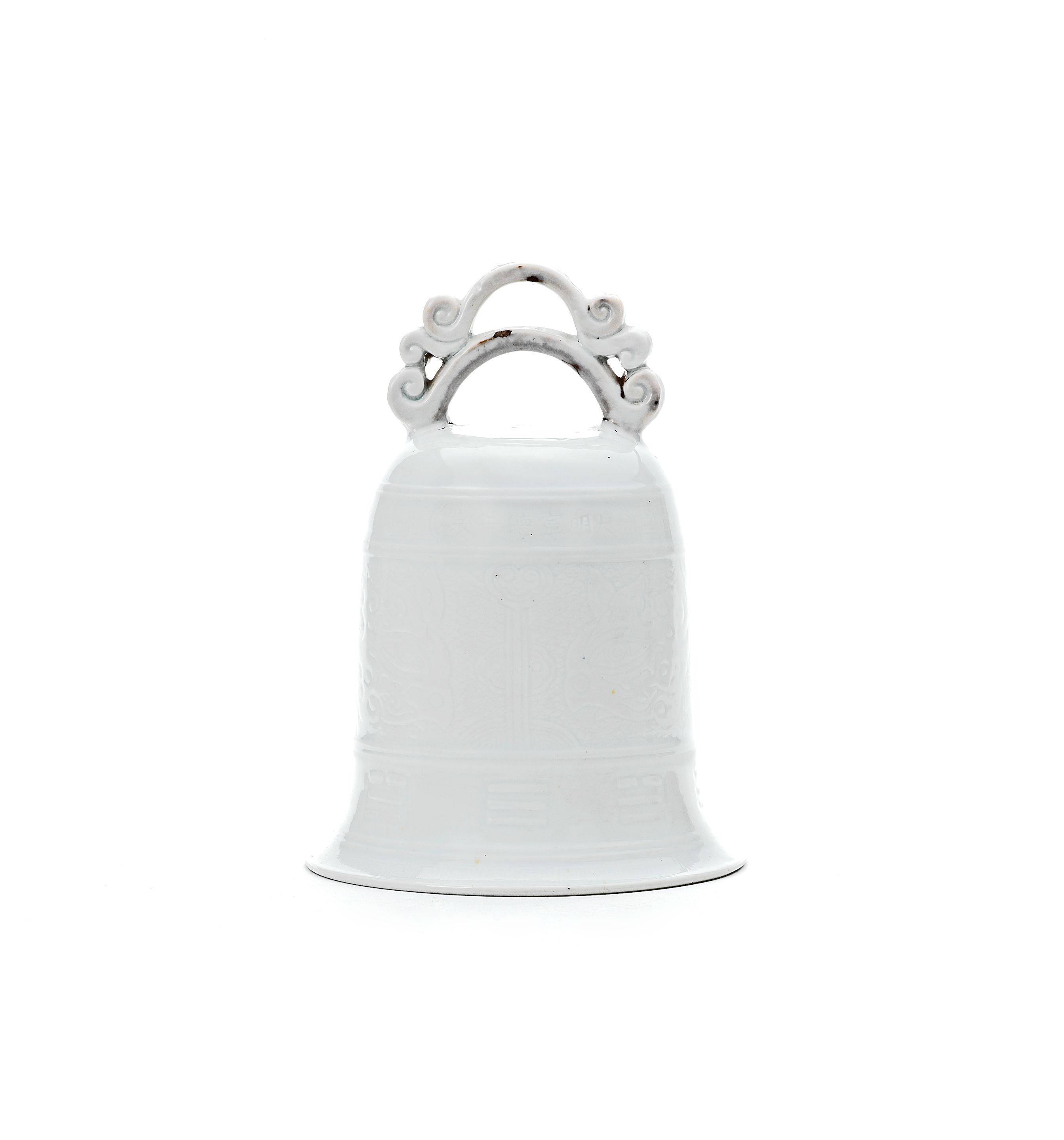 Bonhams : A rare white-glazed bell, Zhong Incised Xuande six-character ...