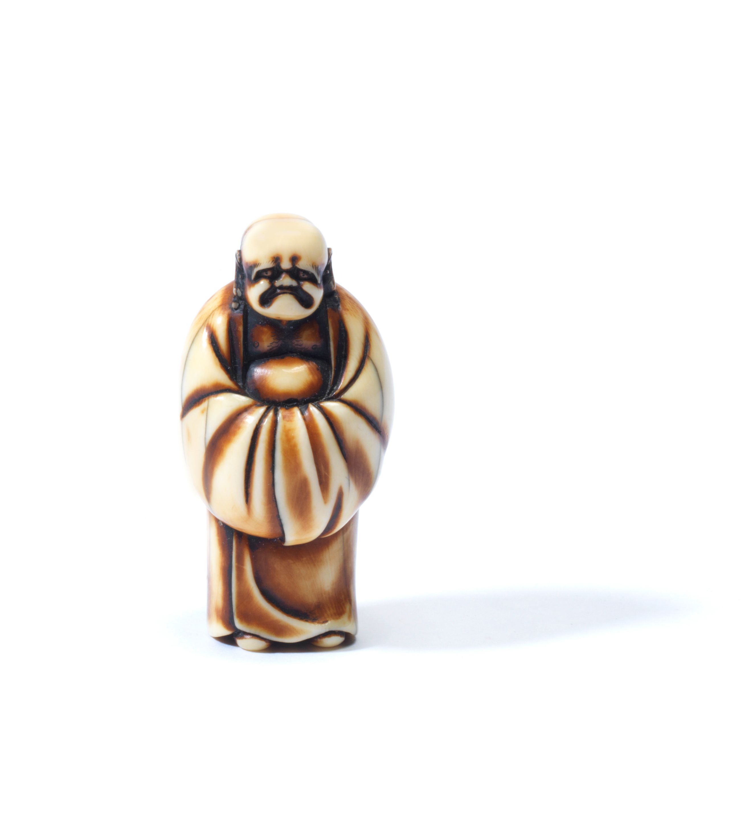 Bonhams : An ivory netsuke of Daruma By Okamoto Garaku, Osaka, 19th century