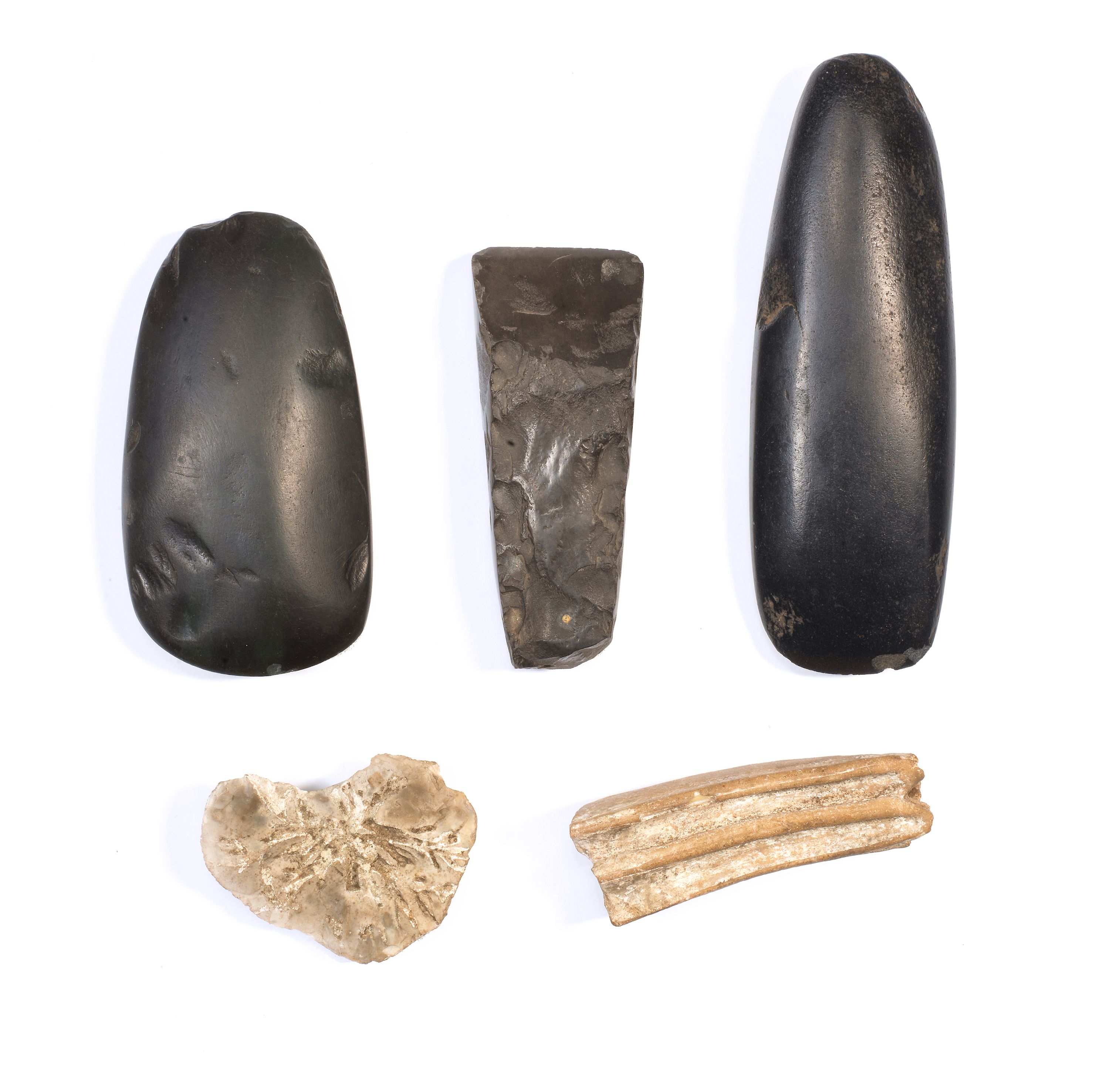 Bonhams : THREE NEOLITHIC STONE AXE HEADS, Qty