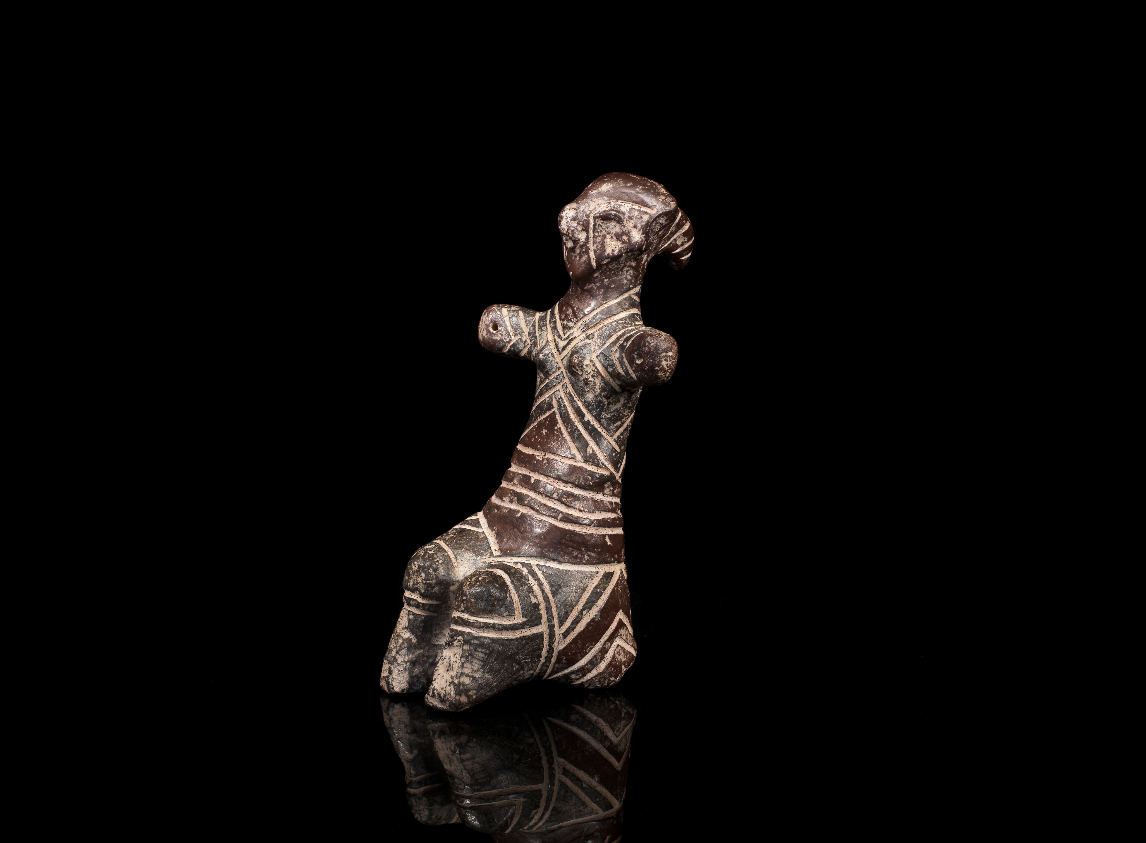 Bonhams : A Vinca terracotta seated idol