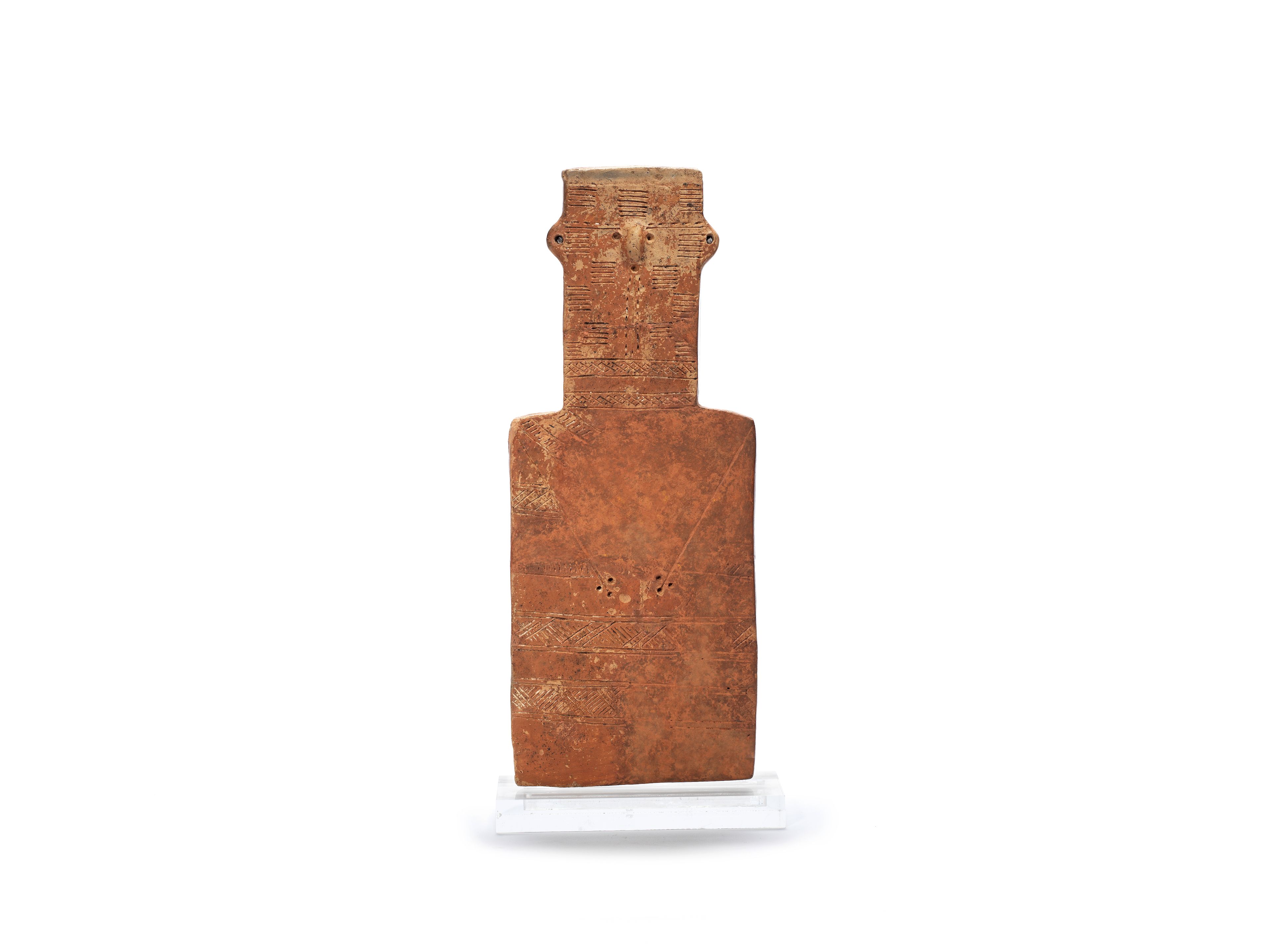 Bonhams : A large Cypriot terracotta plank figure