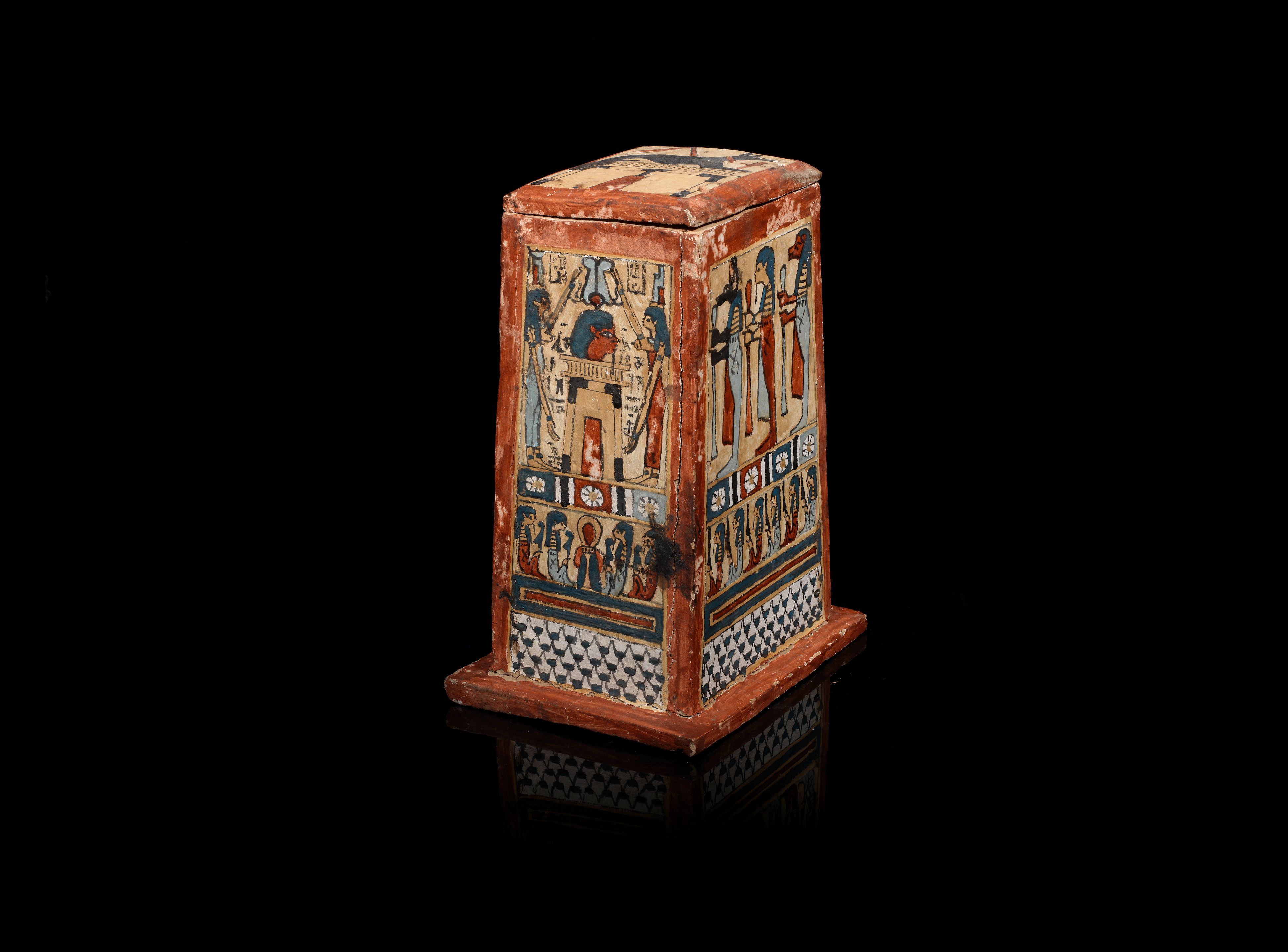 Bonhams : An Egyptian polychrome painted wood canopic jar box