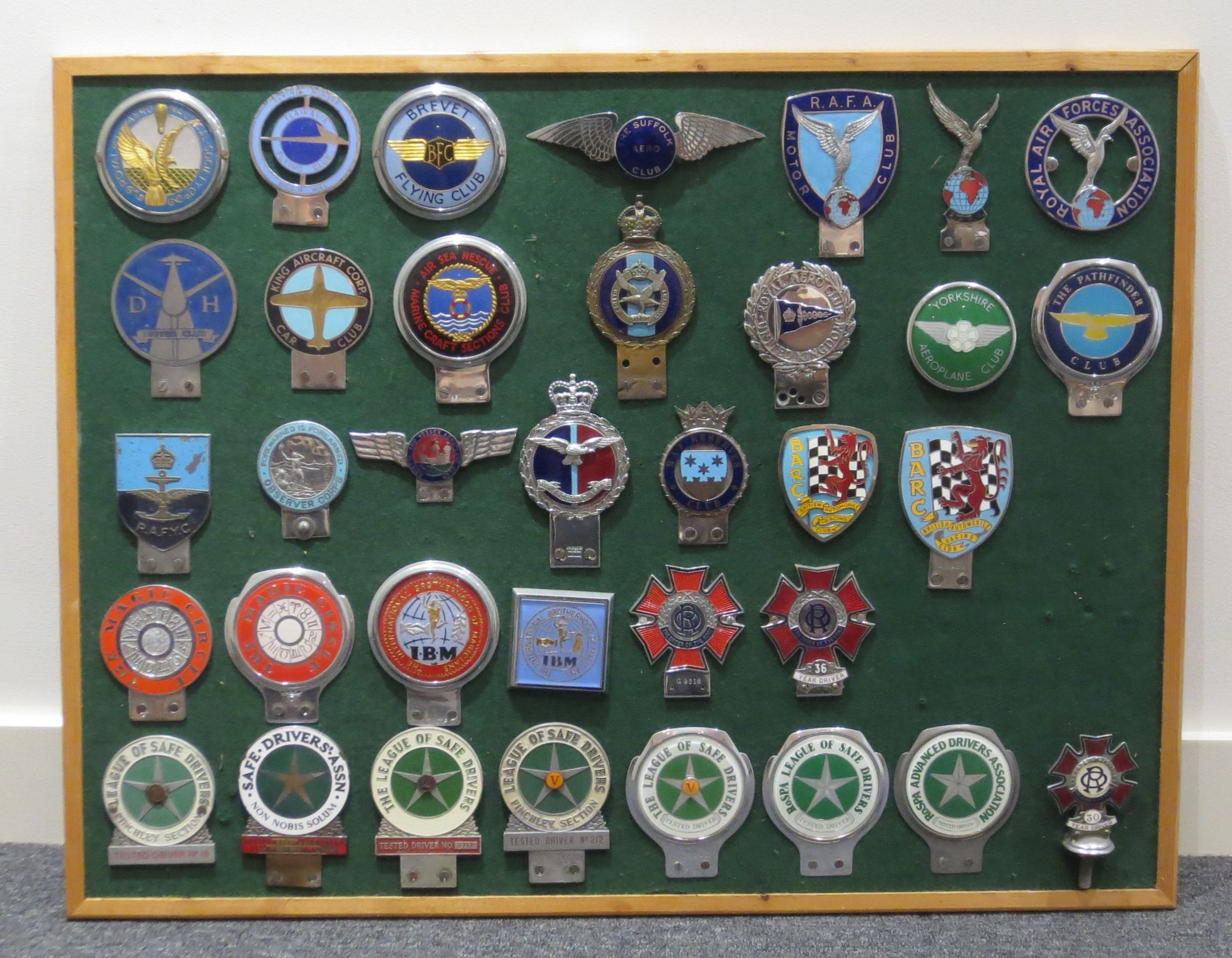 Bonhams Cars : A framed display of Aero Club and other car badges,
