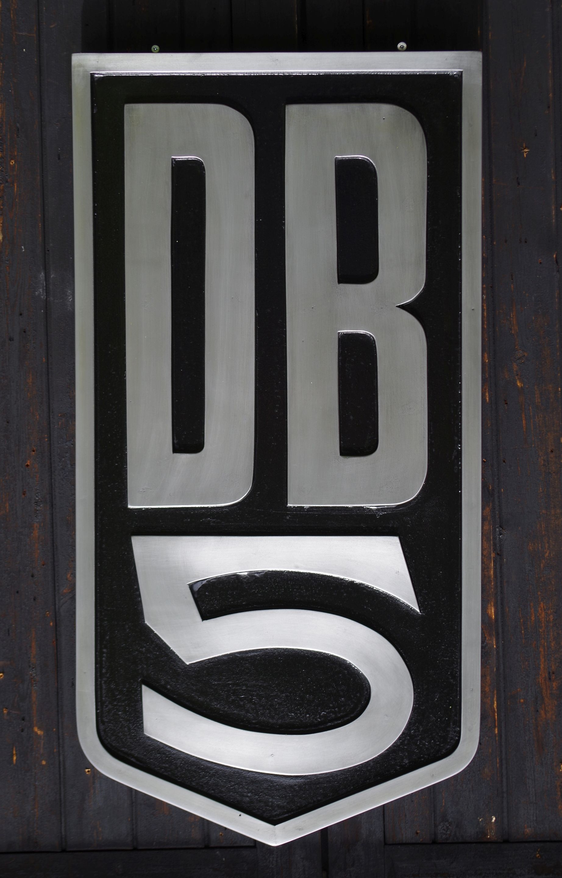 Bonhams Cars : An Aston Martin 'DB5' garage display emblem,