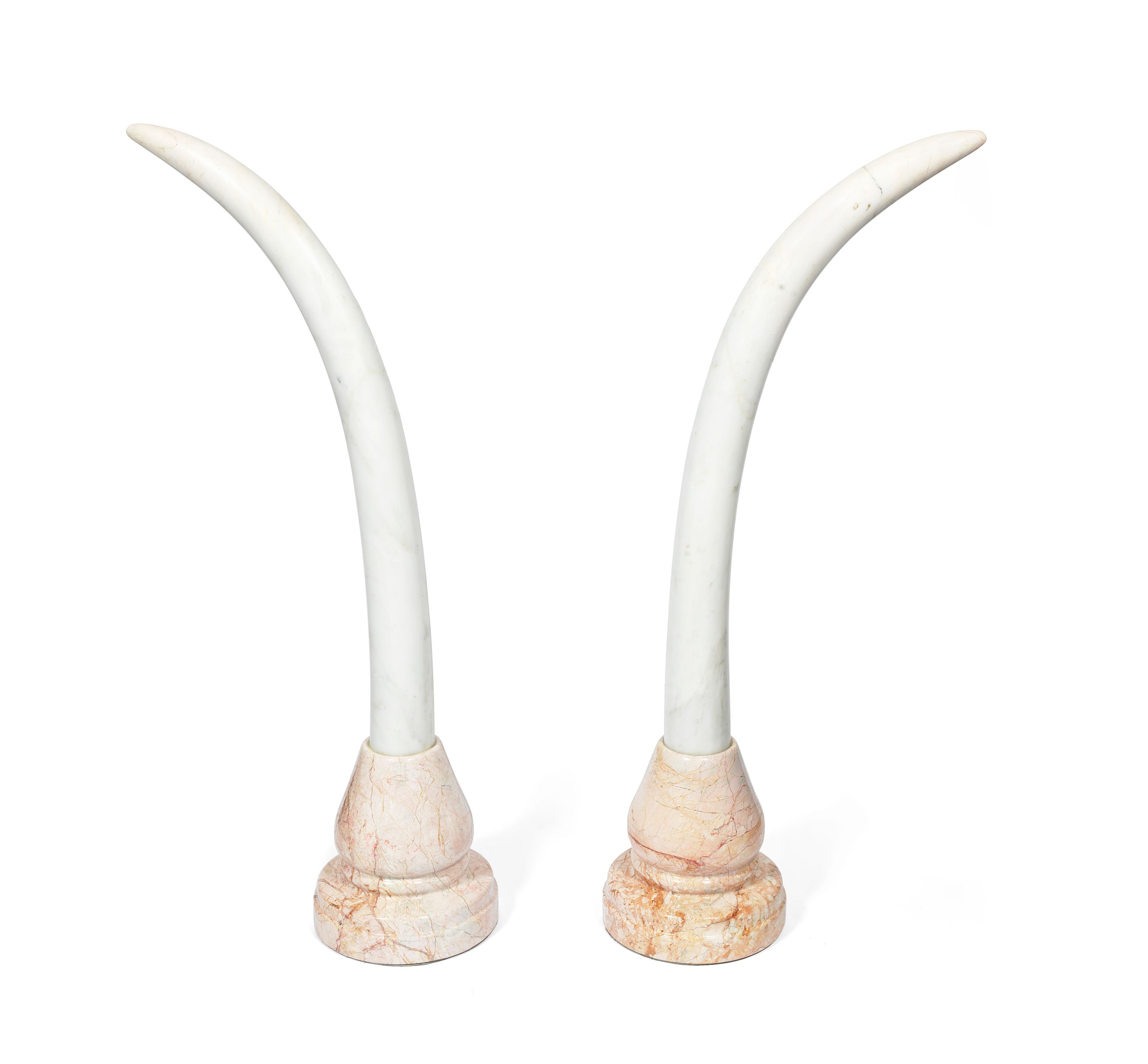 Bonhams : A pair of carved marble 'elephant tusk' ornaments (2)