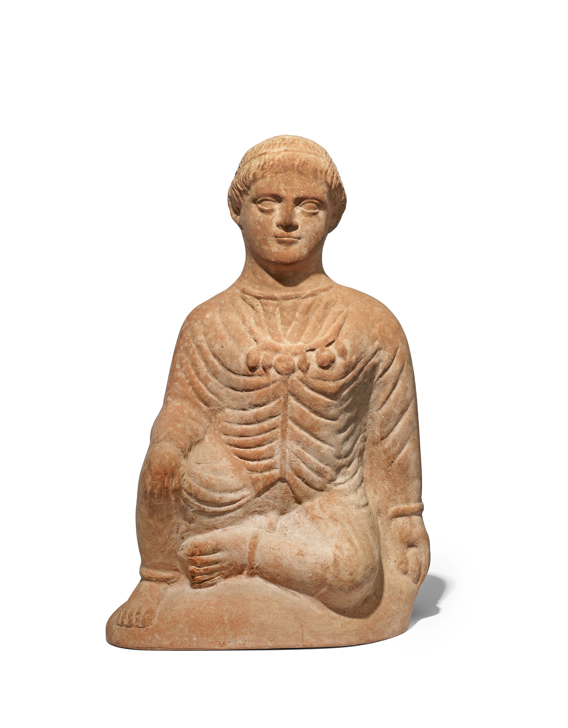 Bonhams : A Cypriot hollow-formed terracotta temple boy