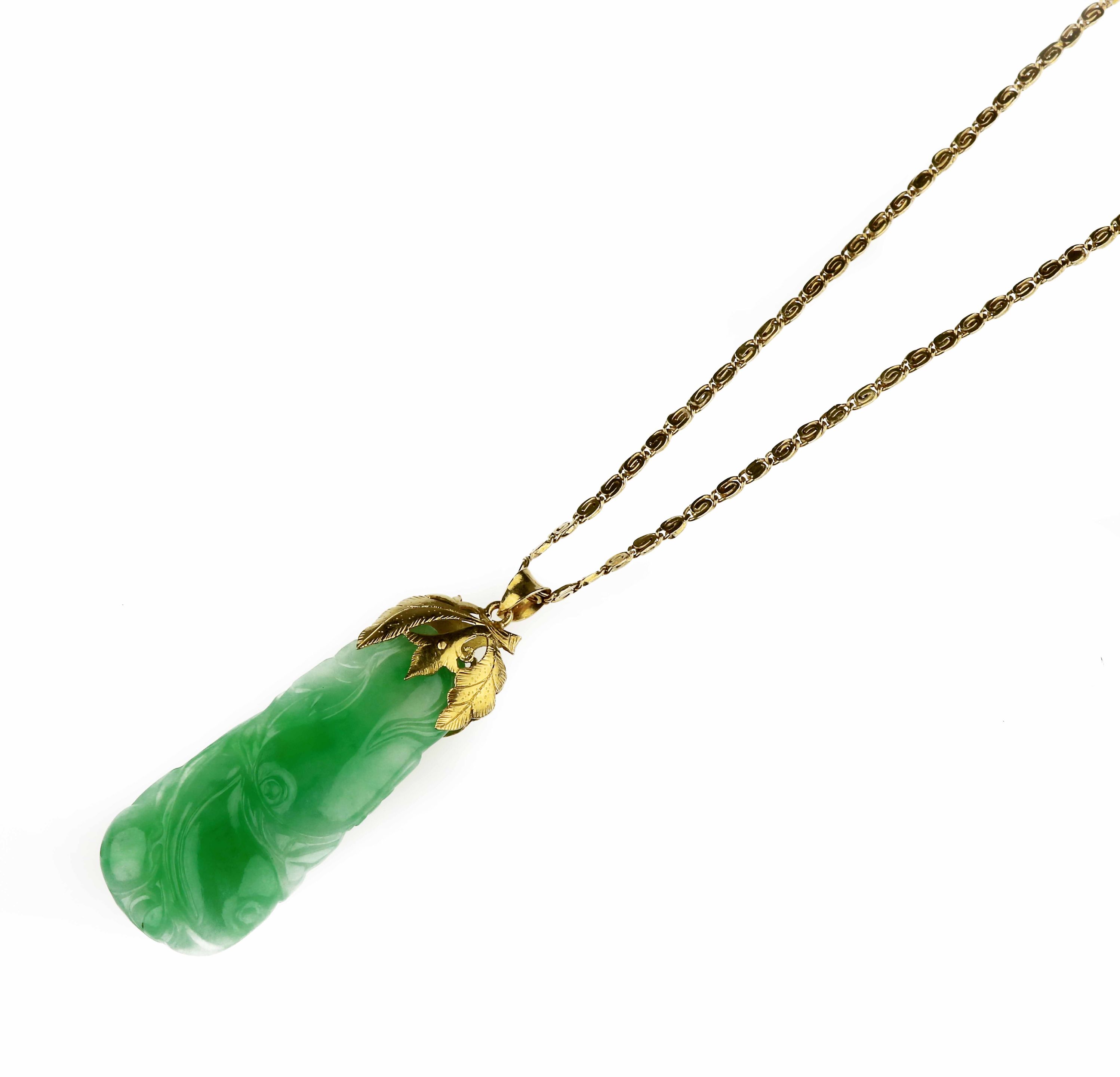 Bonhams : A carved jadeite pendant with chain, early 20th century