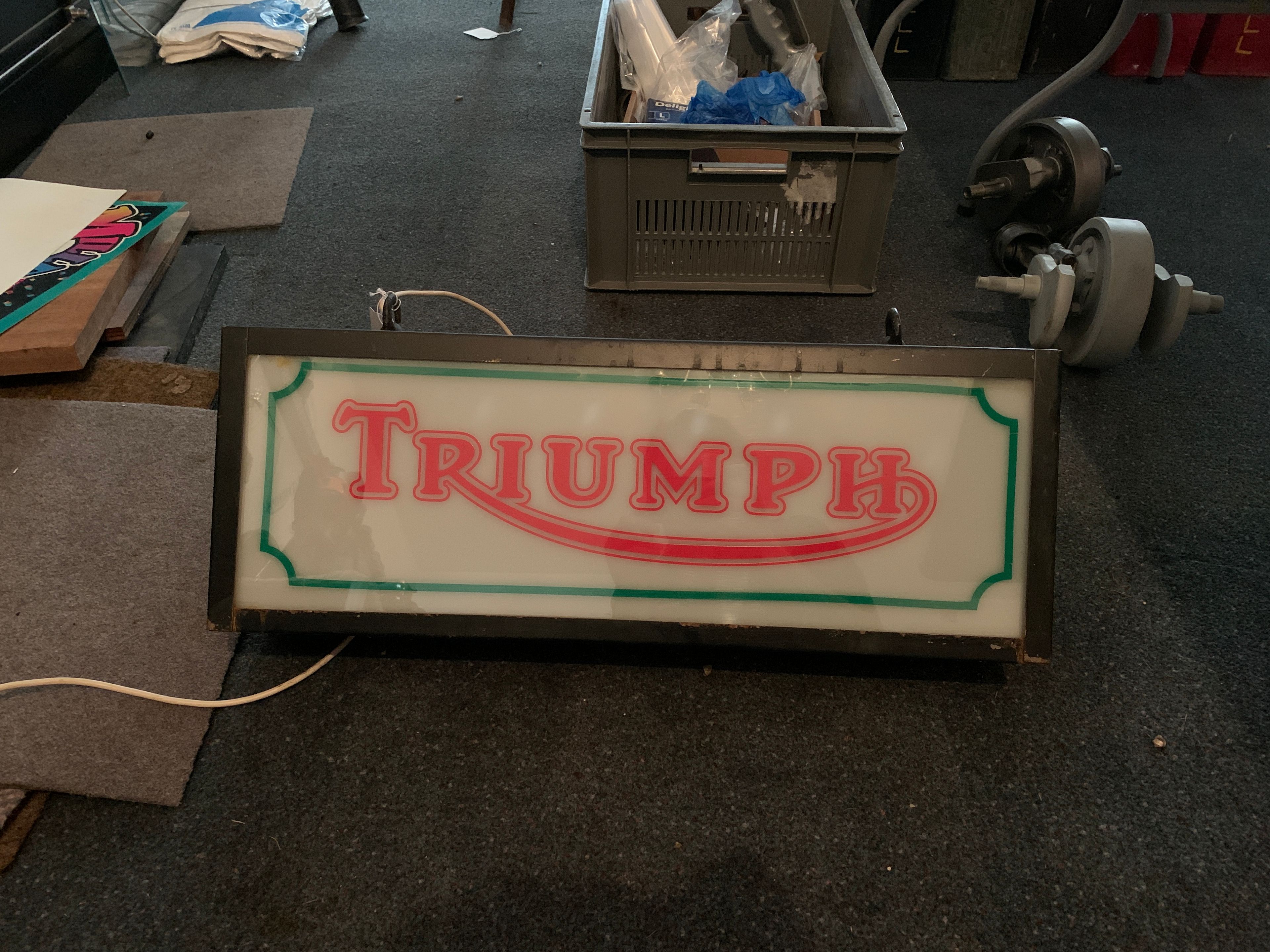 Bonhams Cars : A Triumph illuminated sign