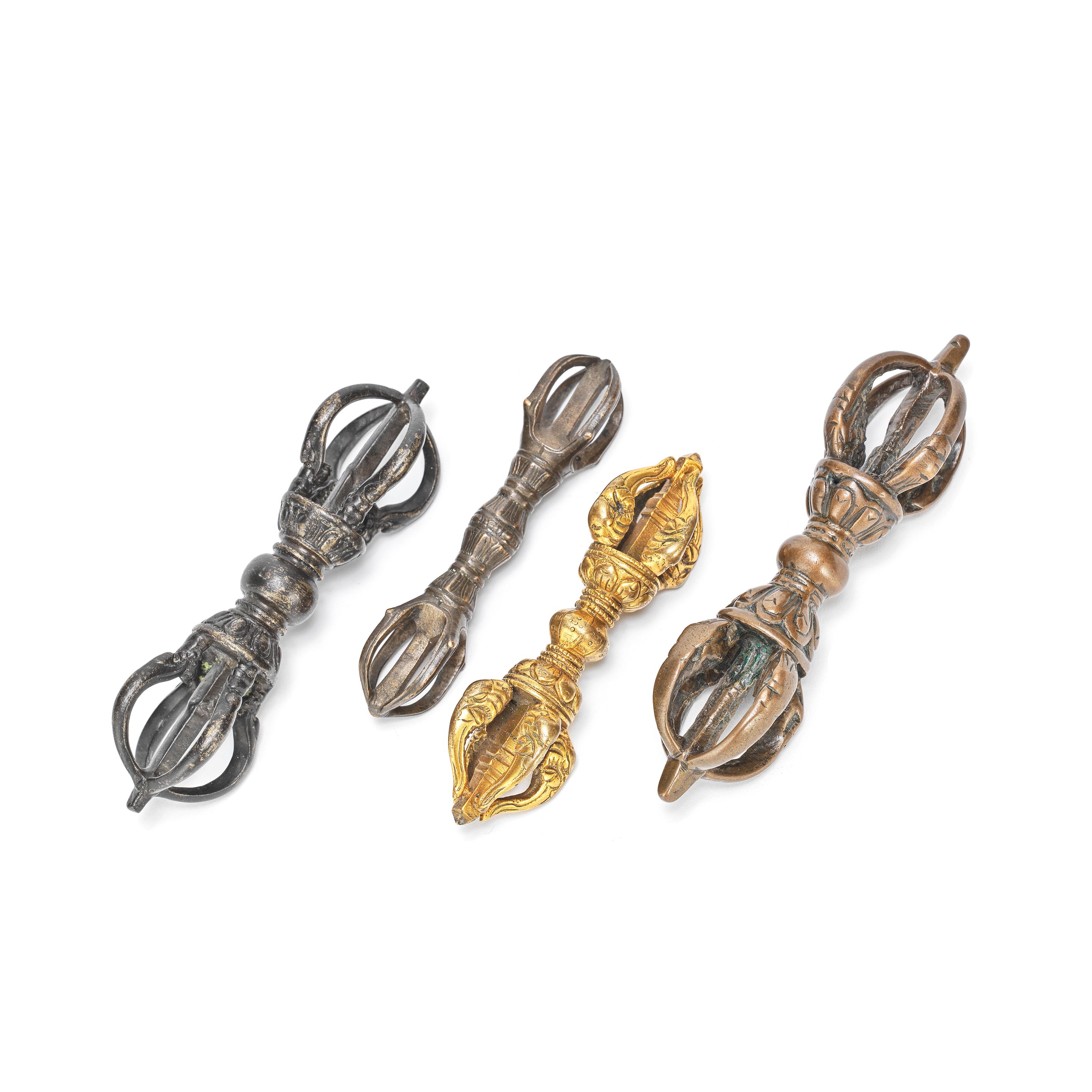 Bonhams : FOUR BRONZE AND GILT BRONZE VAJRAS 17th century and later (4)