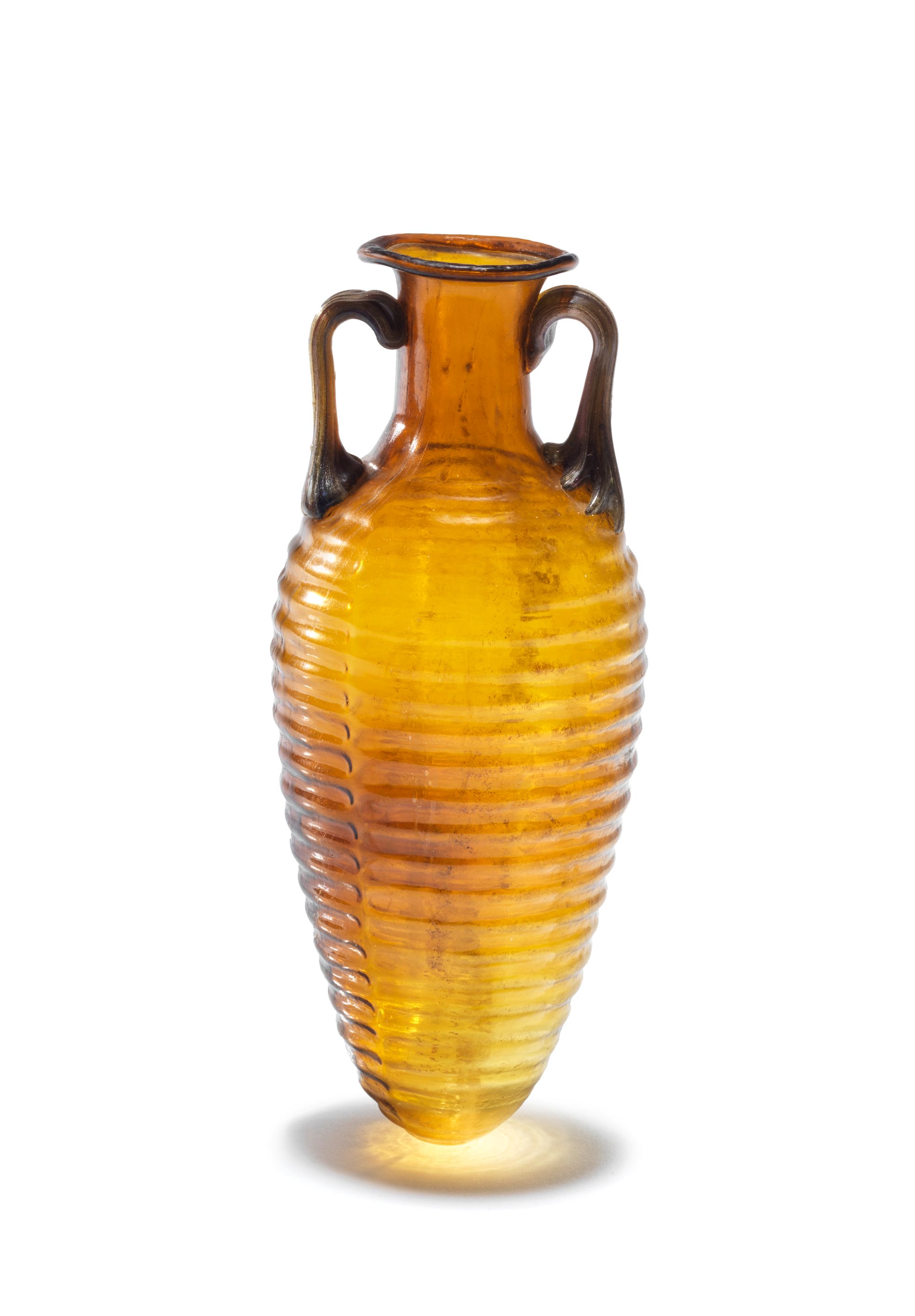 Bonhams : A Roman amber glass ribbed amphora