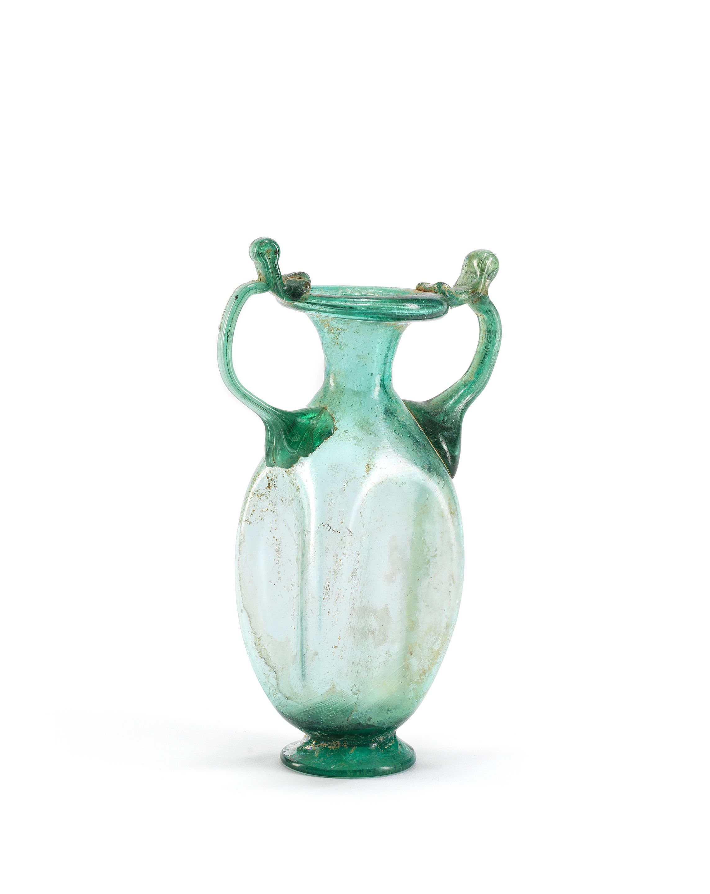 Bonhams : A Roman green glass two-handled dimpled bottle