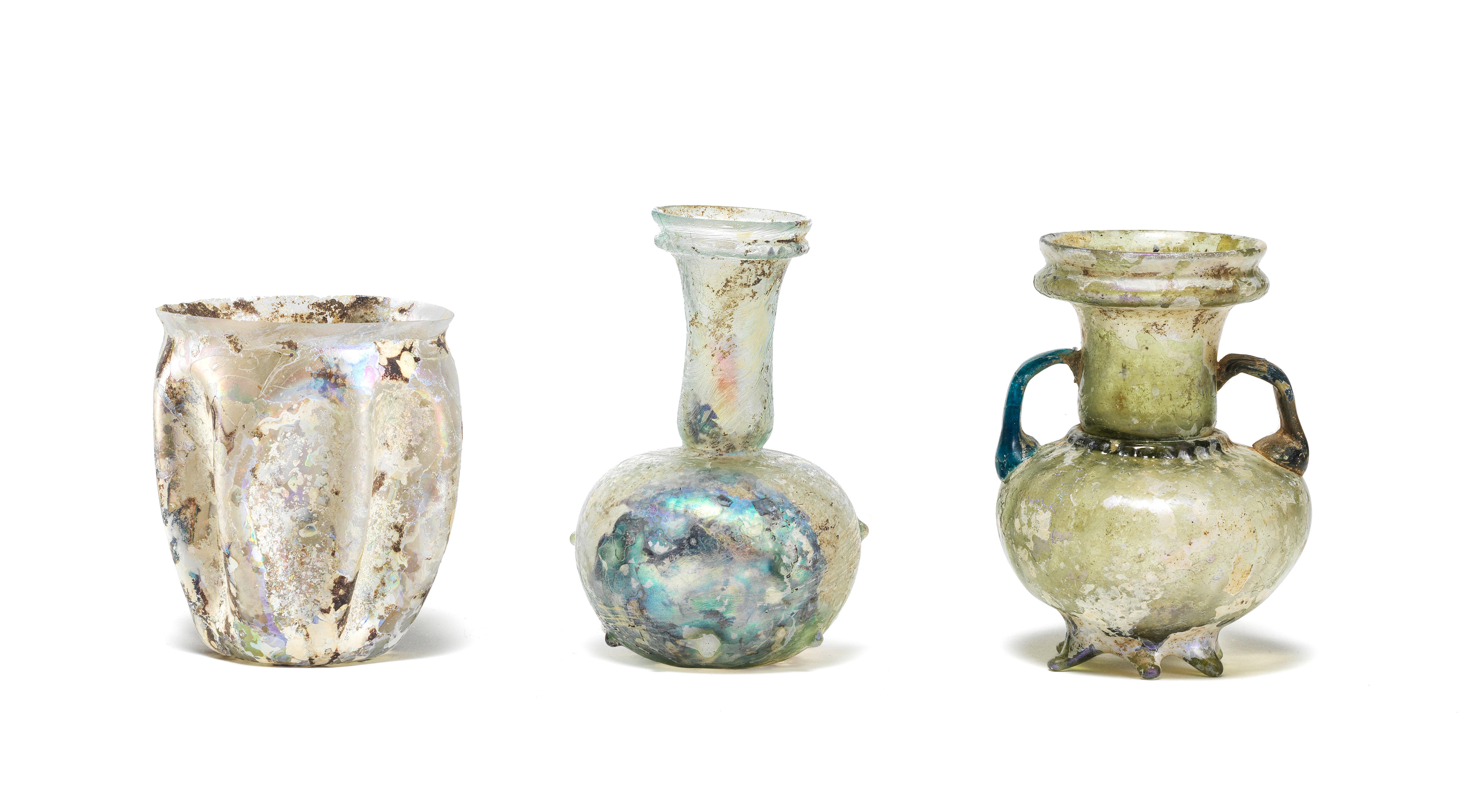 Bonhams : A Roman green glass sprinkler flask, a Roman pale blue-green ...