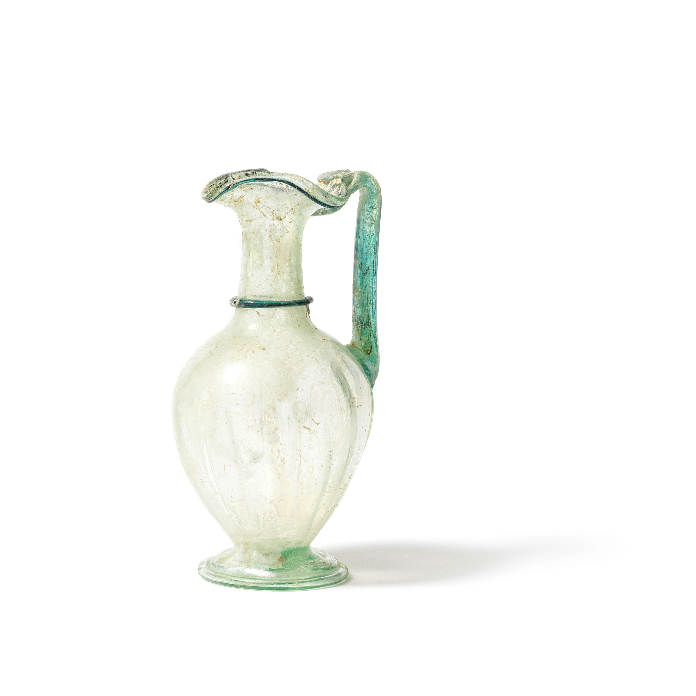 Bonhams : A Roman glass ribbed trefoil-lipped jug