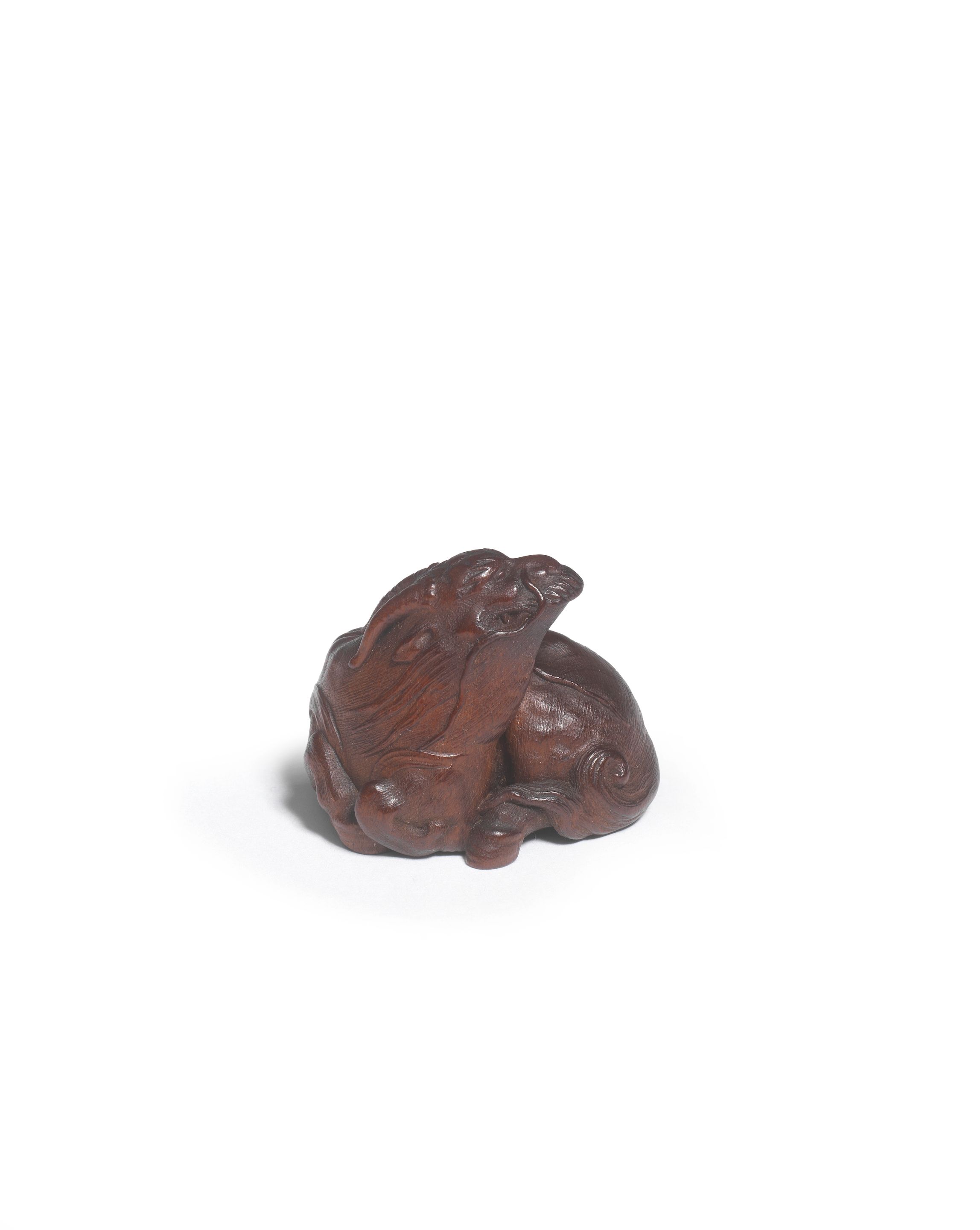 Bonhams : A WOOD NETSUKE OF A RECUMBENT KIRIN By Ikkan (1817-1893 ...
