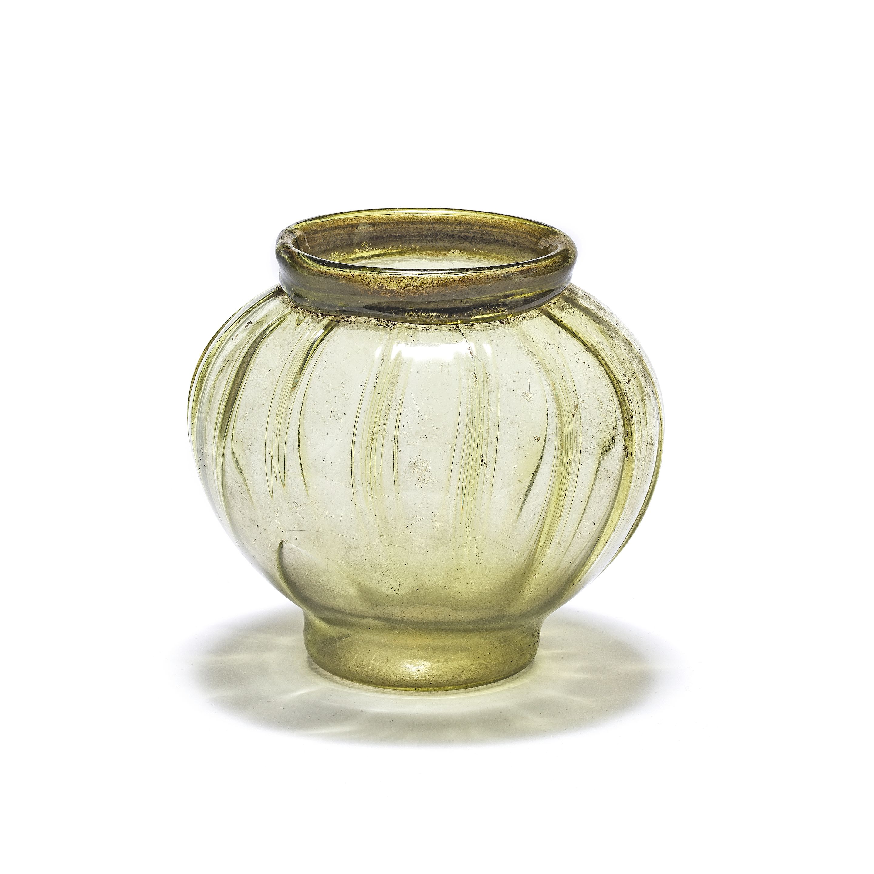 Bonhams : A Gallo-Roman yellow-green glass ribbed spherical jar