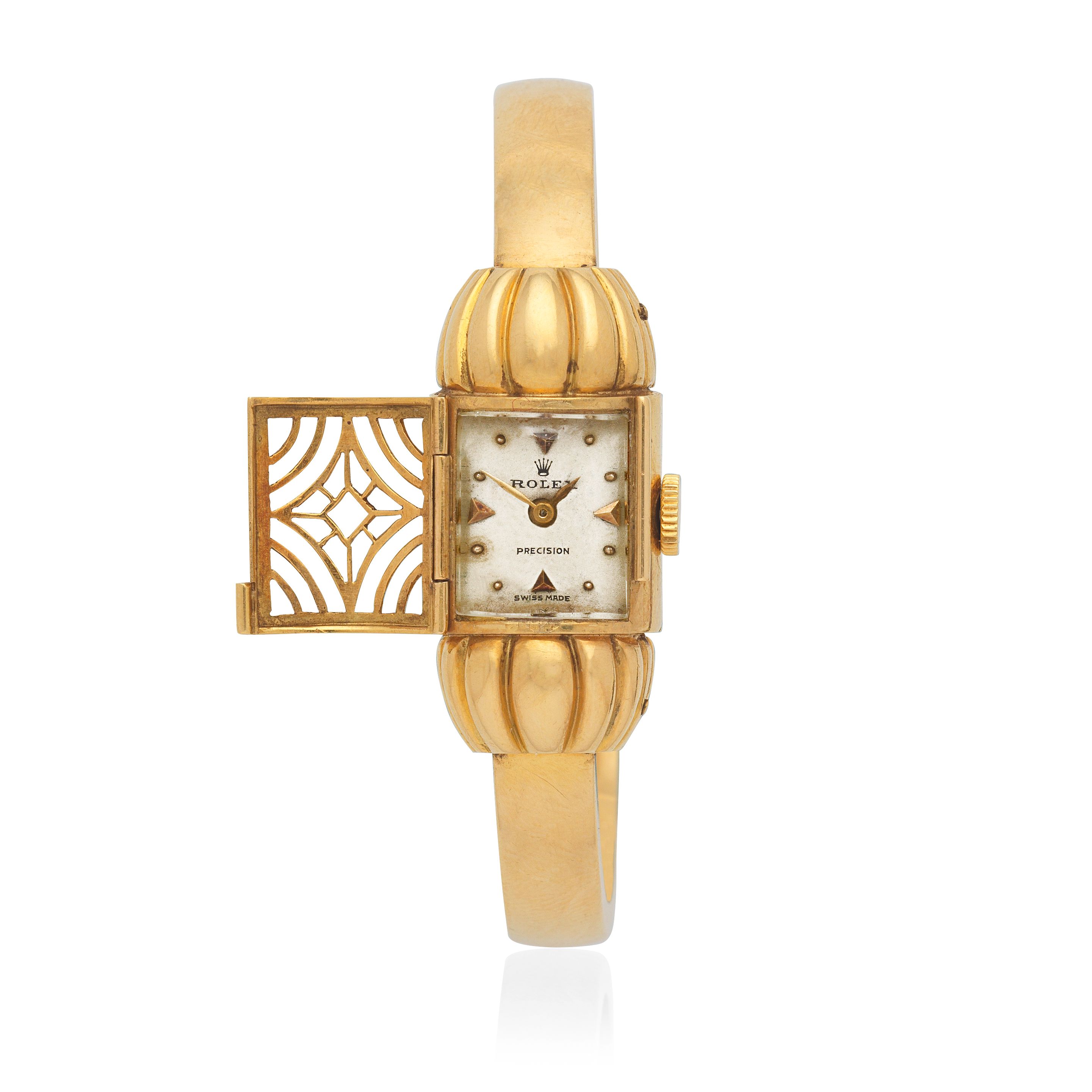 Bonhams : Rolex. A lady's 18K gold manual wind bangle watch with ...