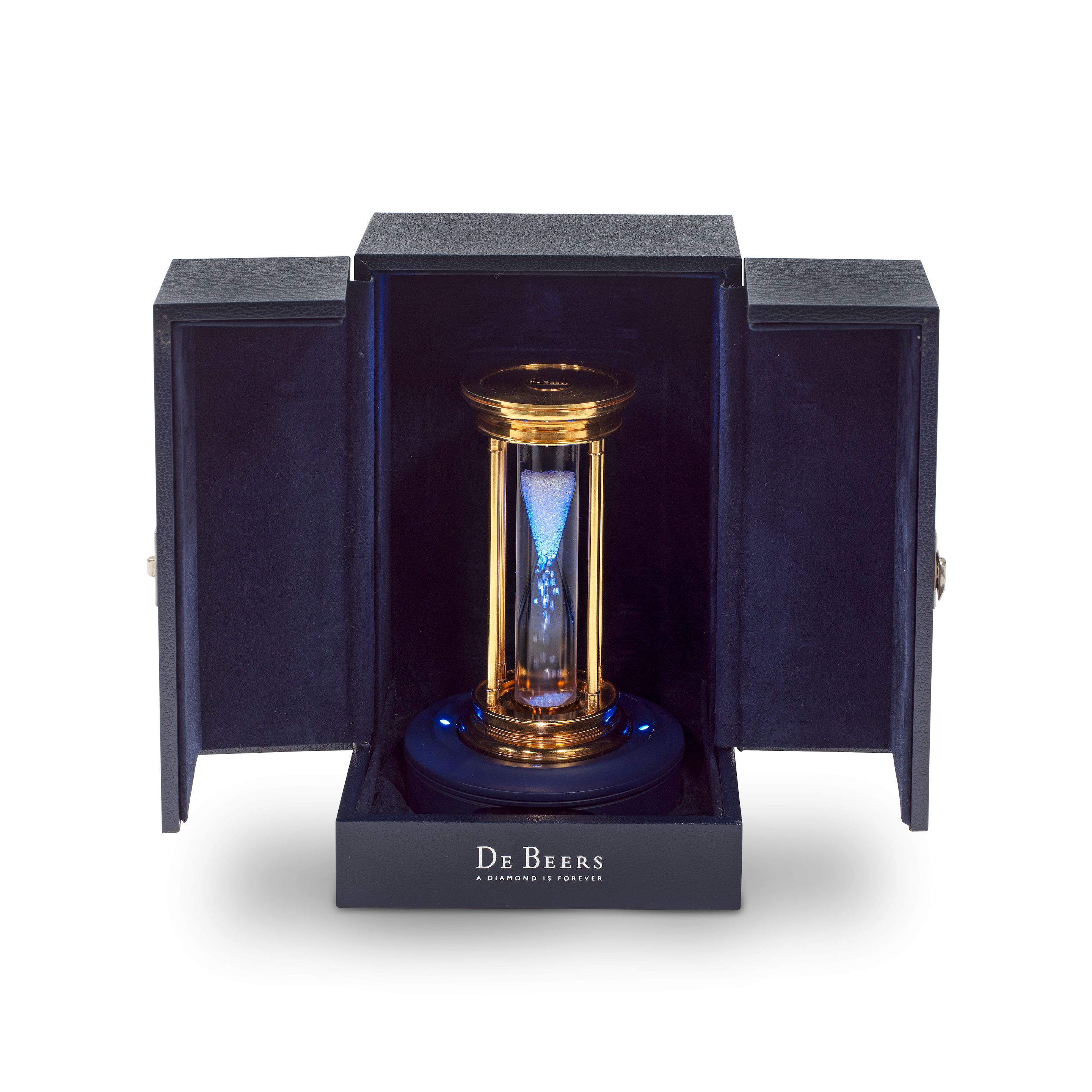Bonhams : DeBeers. A fine gold plated hourglass with floating diamonds ...