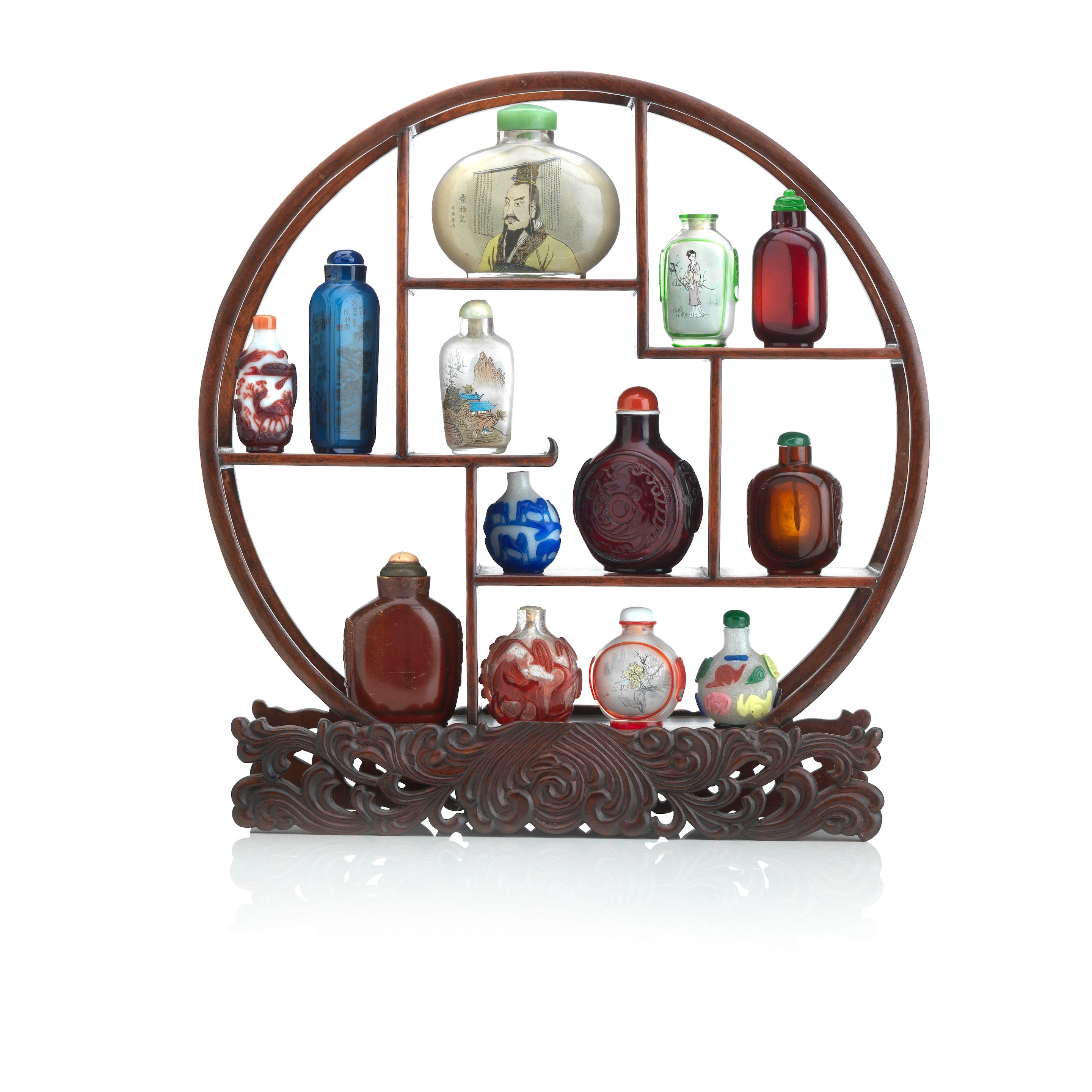 Bonhams : A Chinese circular hardwood display stand and Chinese snuff ...